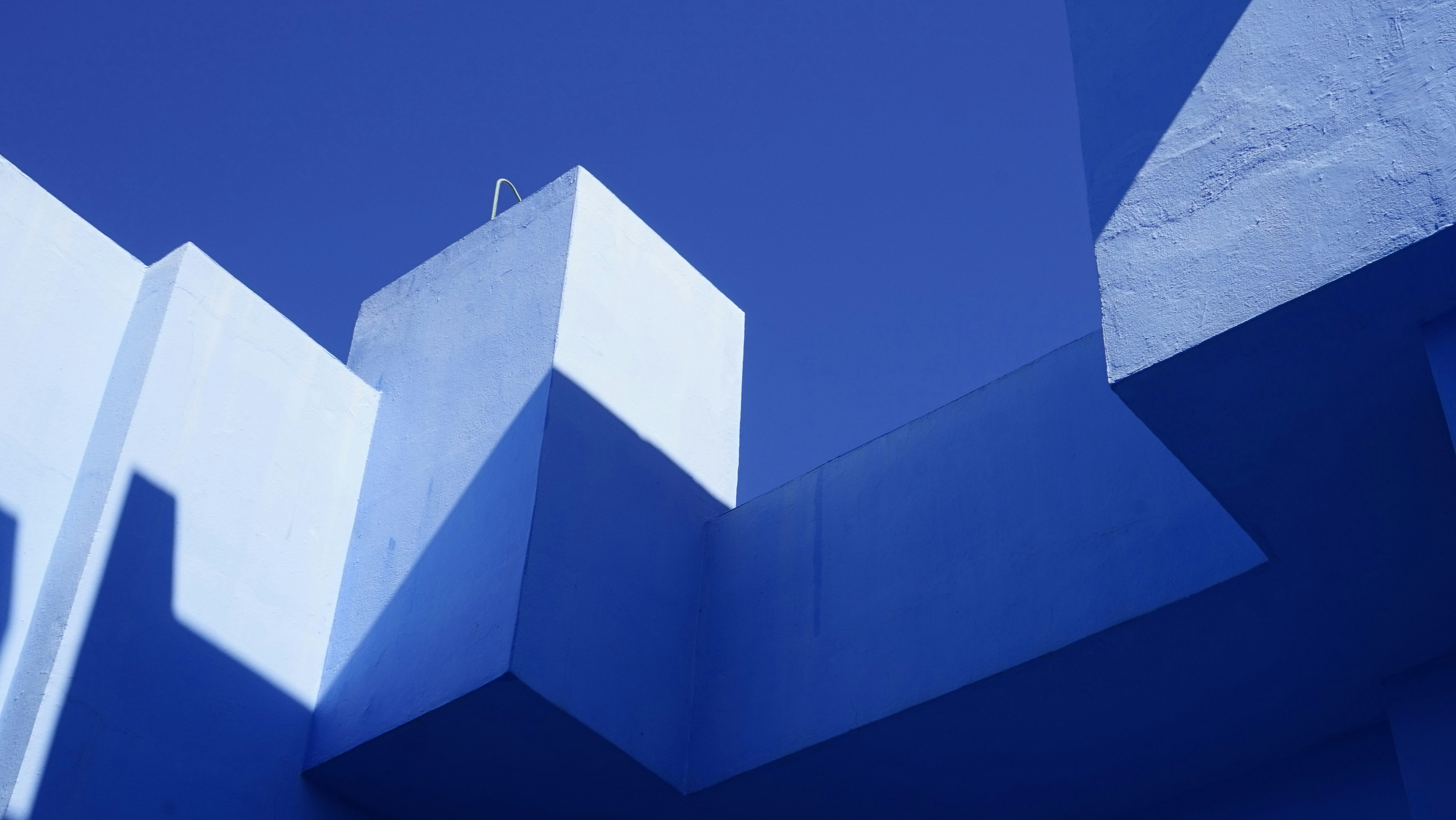 A blue building with white walls and a blue sky photo – Free Blue Image ...