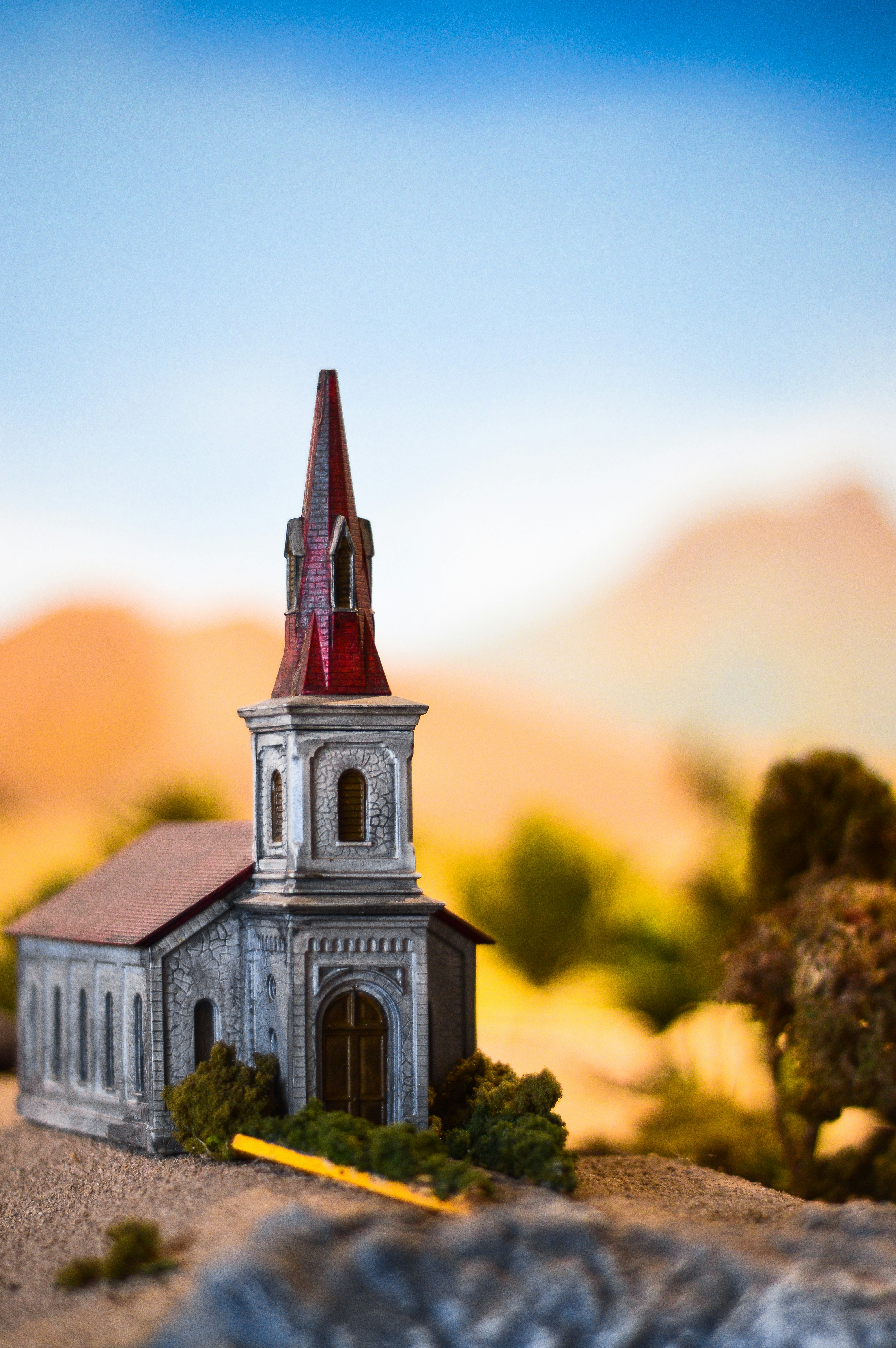 Miniature Sanctuary: A Tiny Church Amid a Dreamy Backdrop