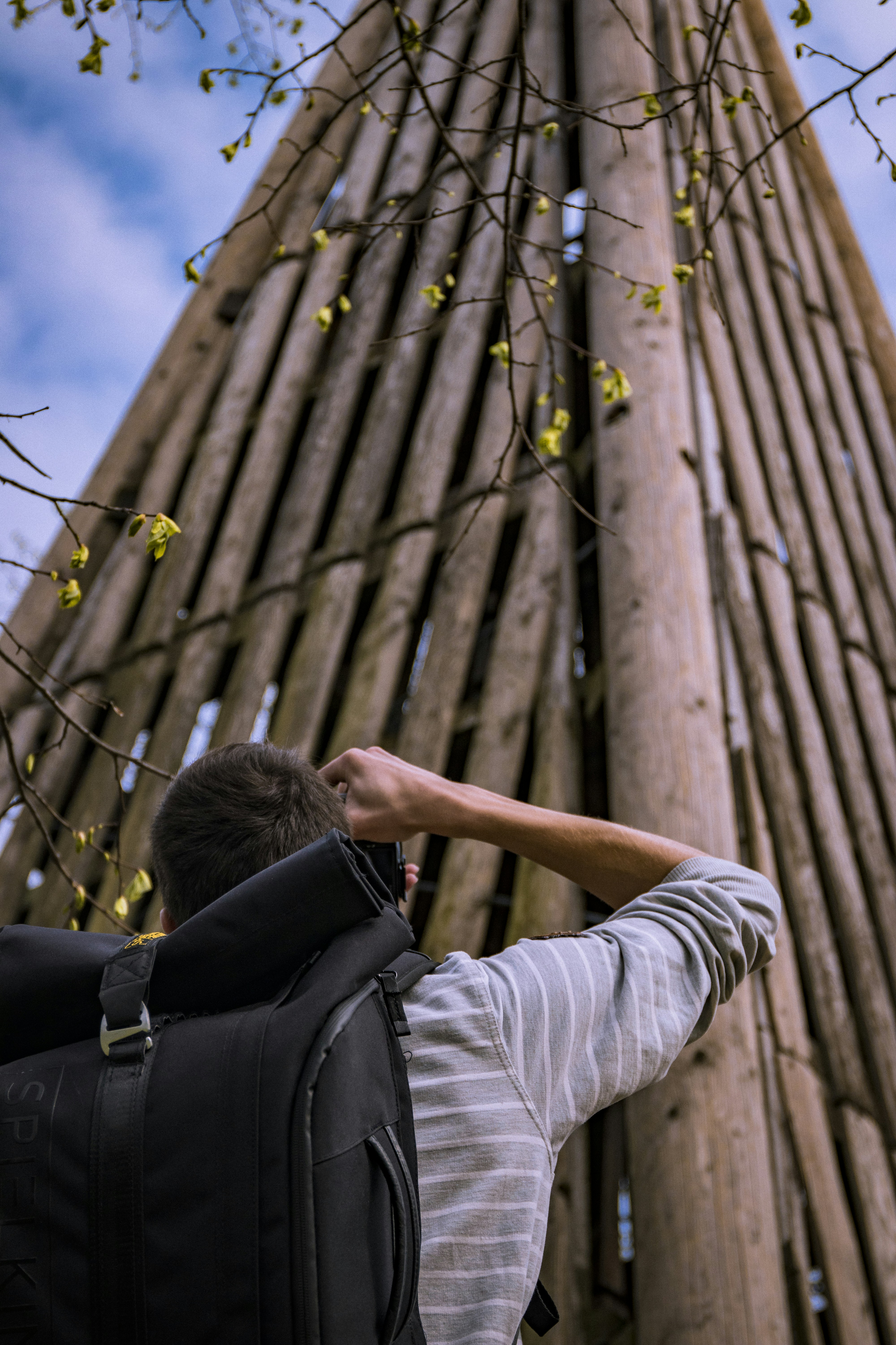 Climber Gaze Toward a Wooden Cathedral