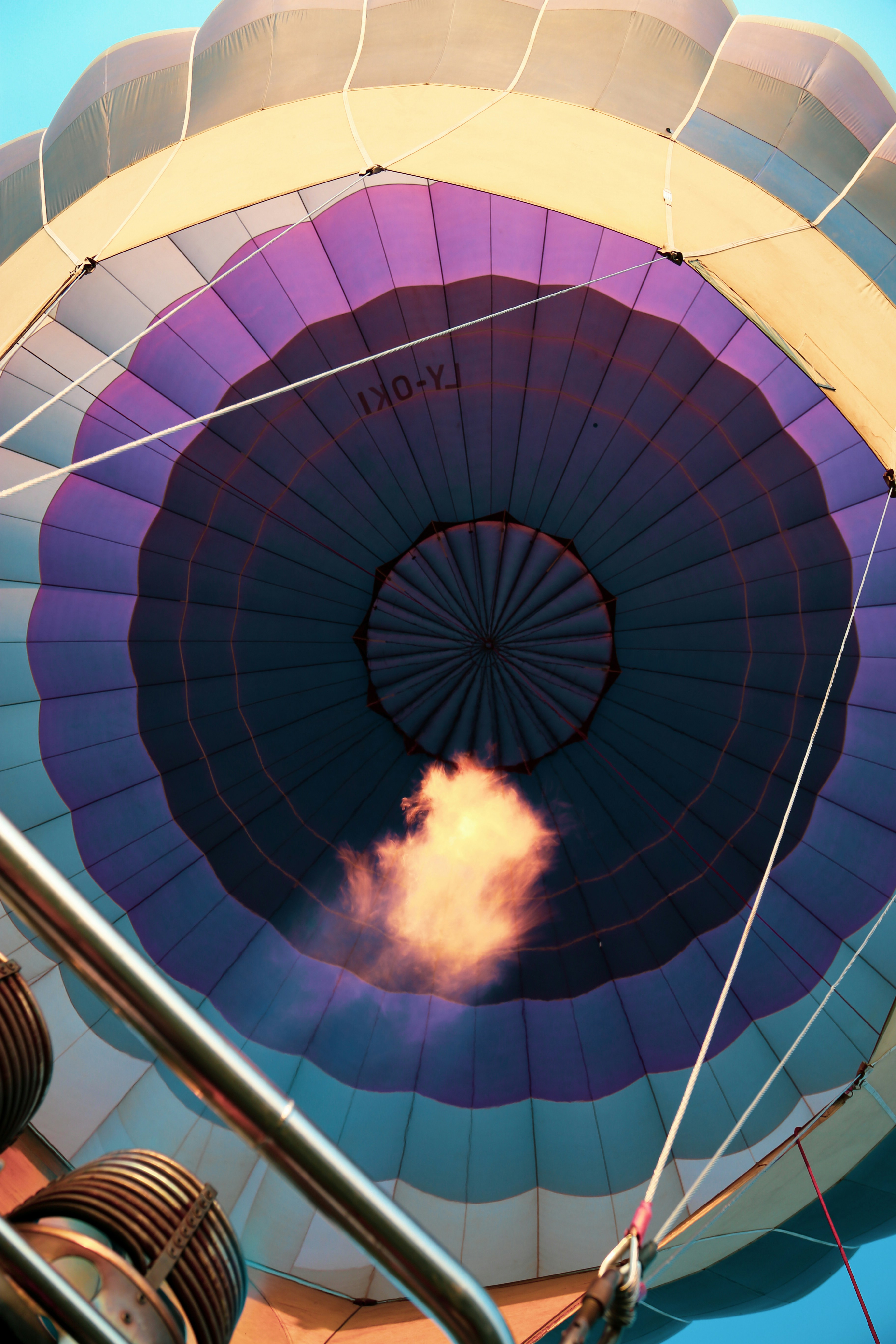 Under the Rainbow Cap: A Close-Up of a Hot Air Balloon’s Opening