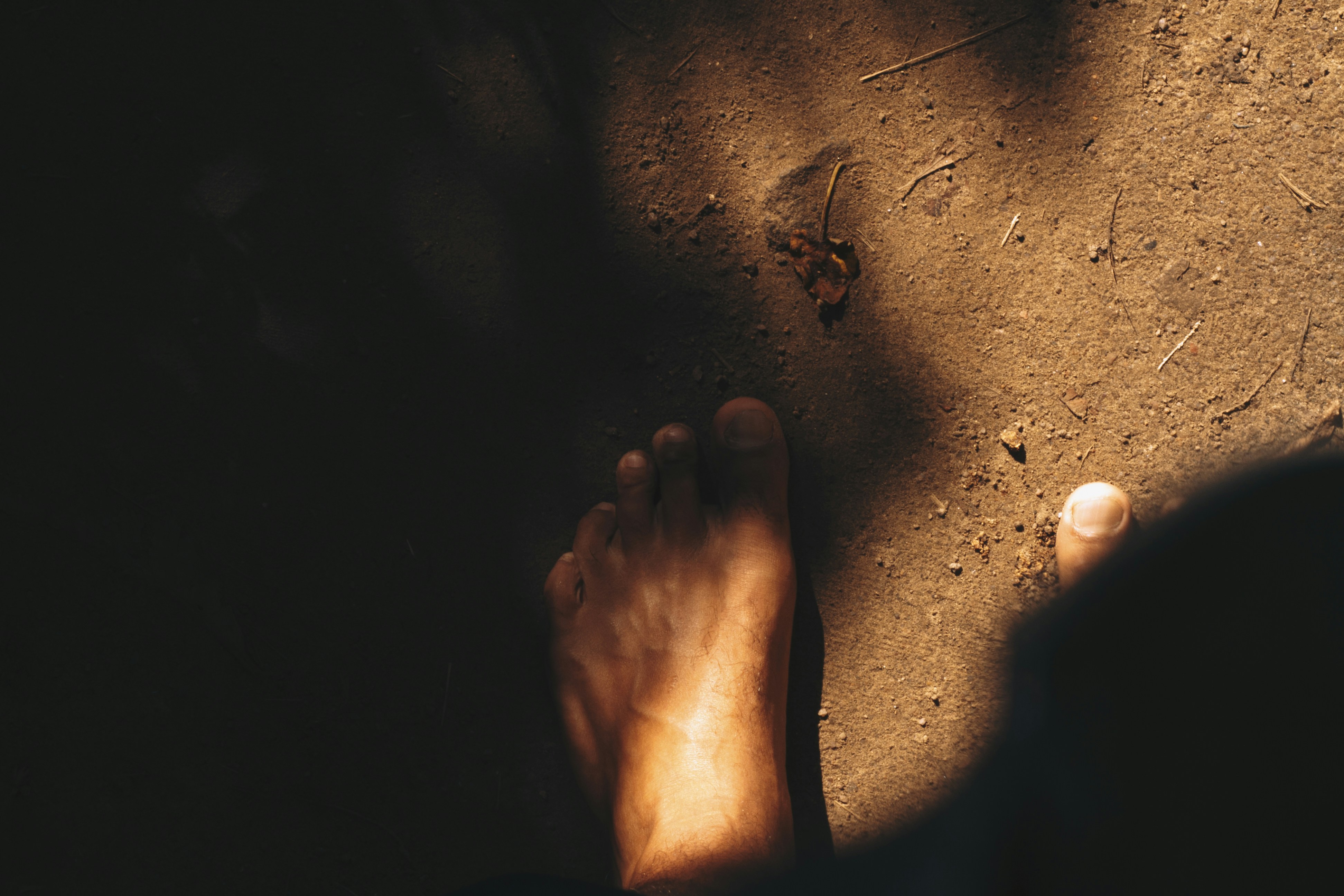 Bare Foot in Dappled Groundlight