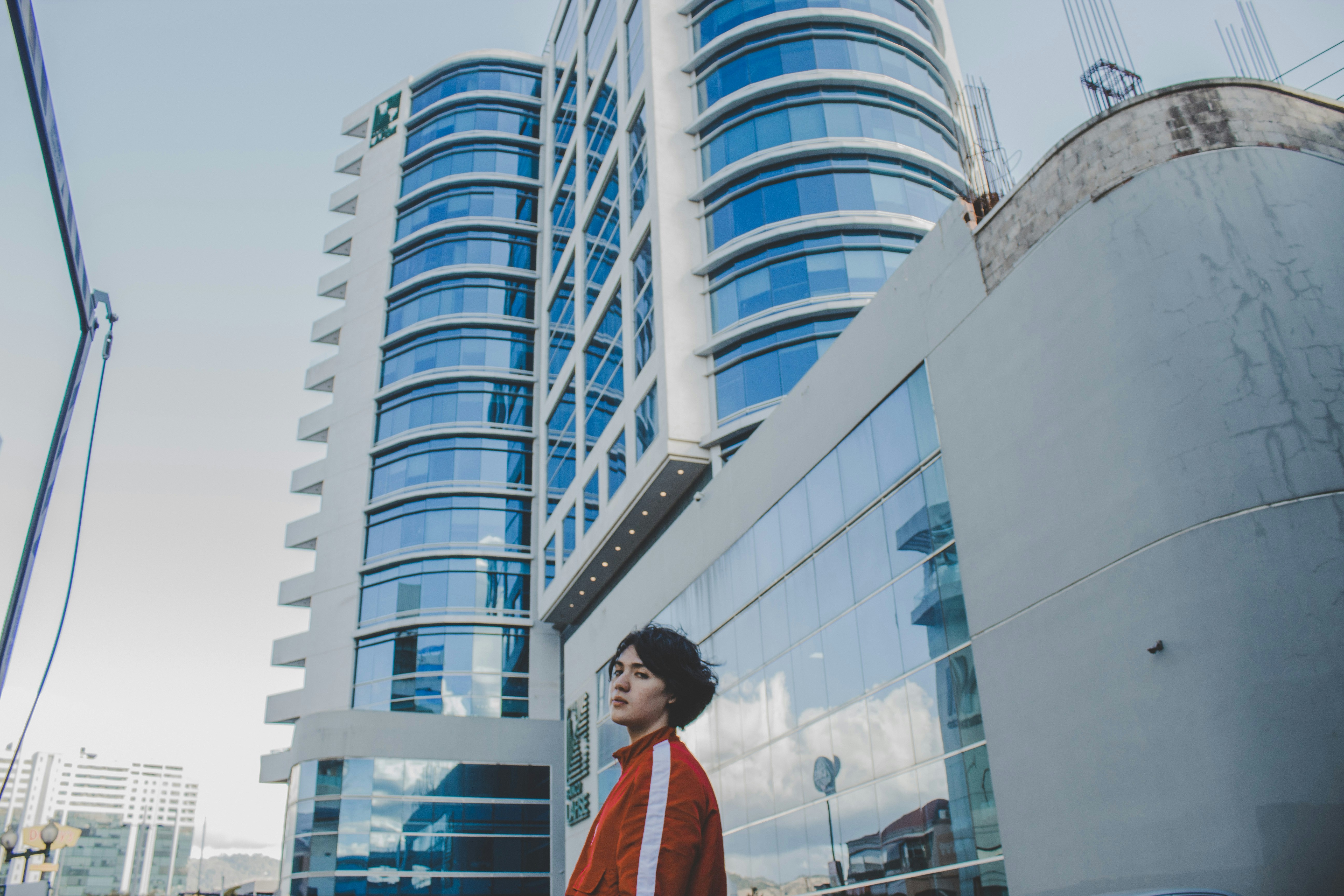 Urban Pose Under Glass Towers
