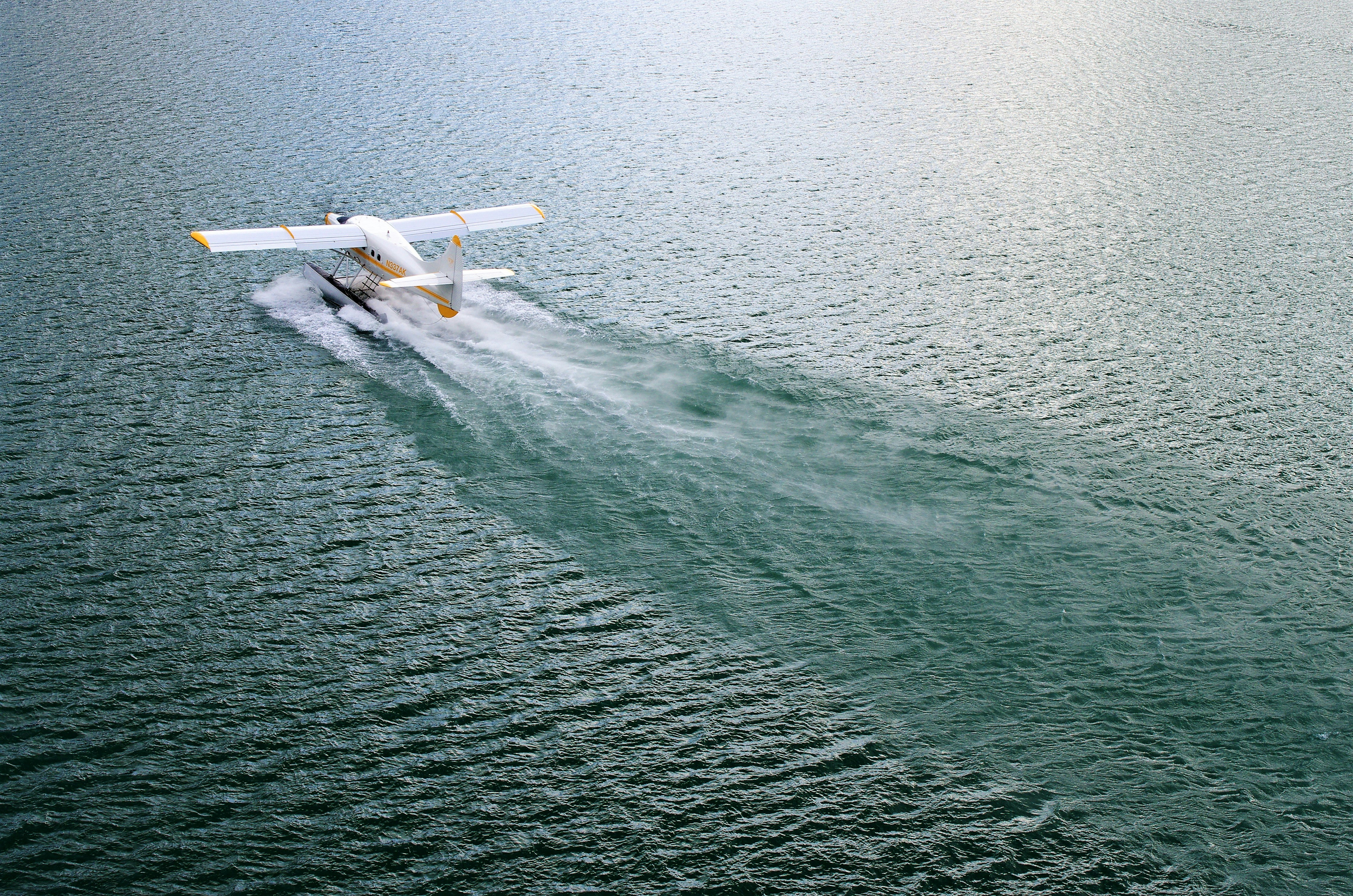 aerial photography of plane on body of water
