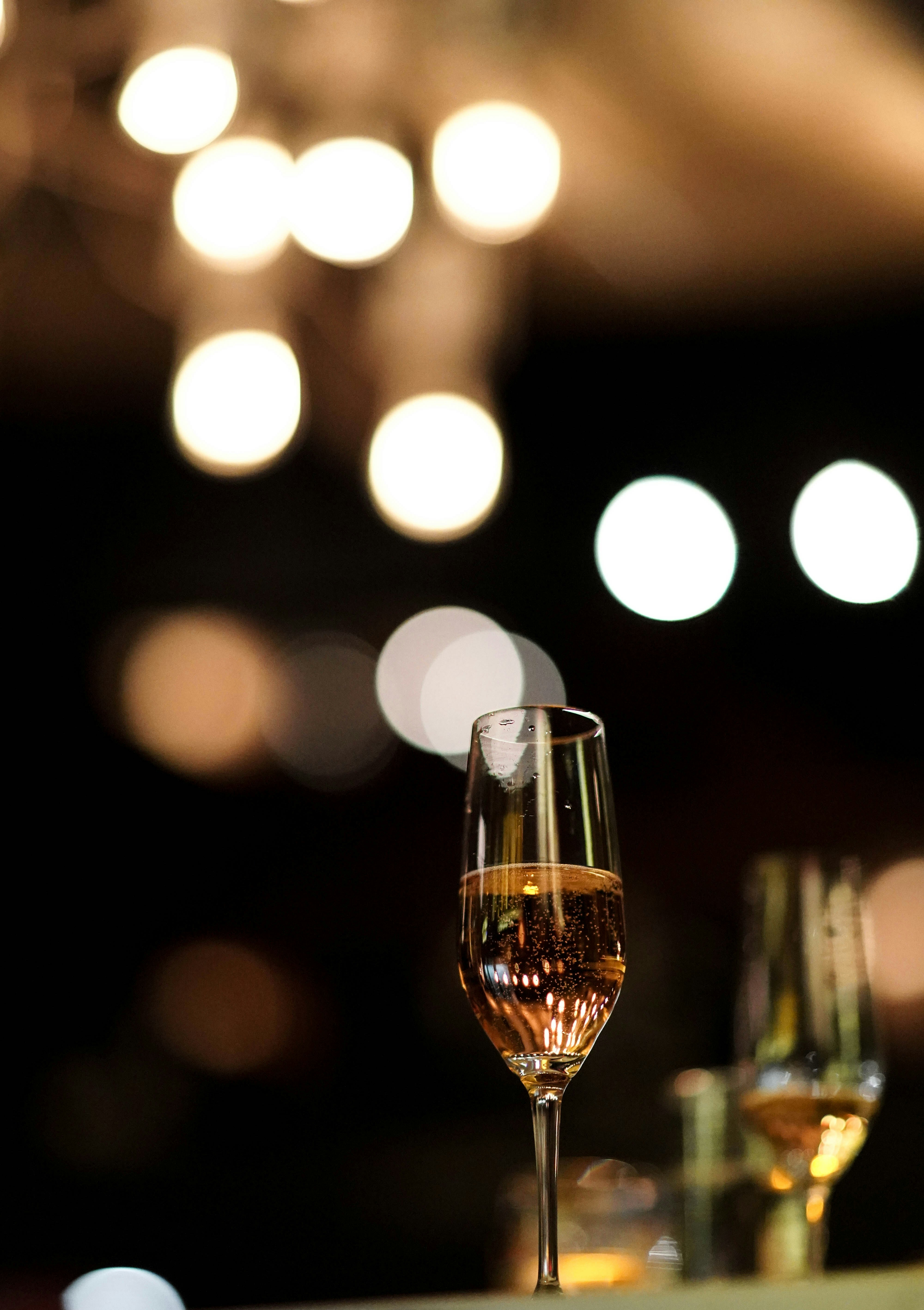 Champagne flute glass filled with liqudi photo – Free Black Image on ...