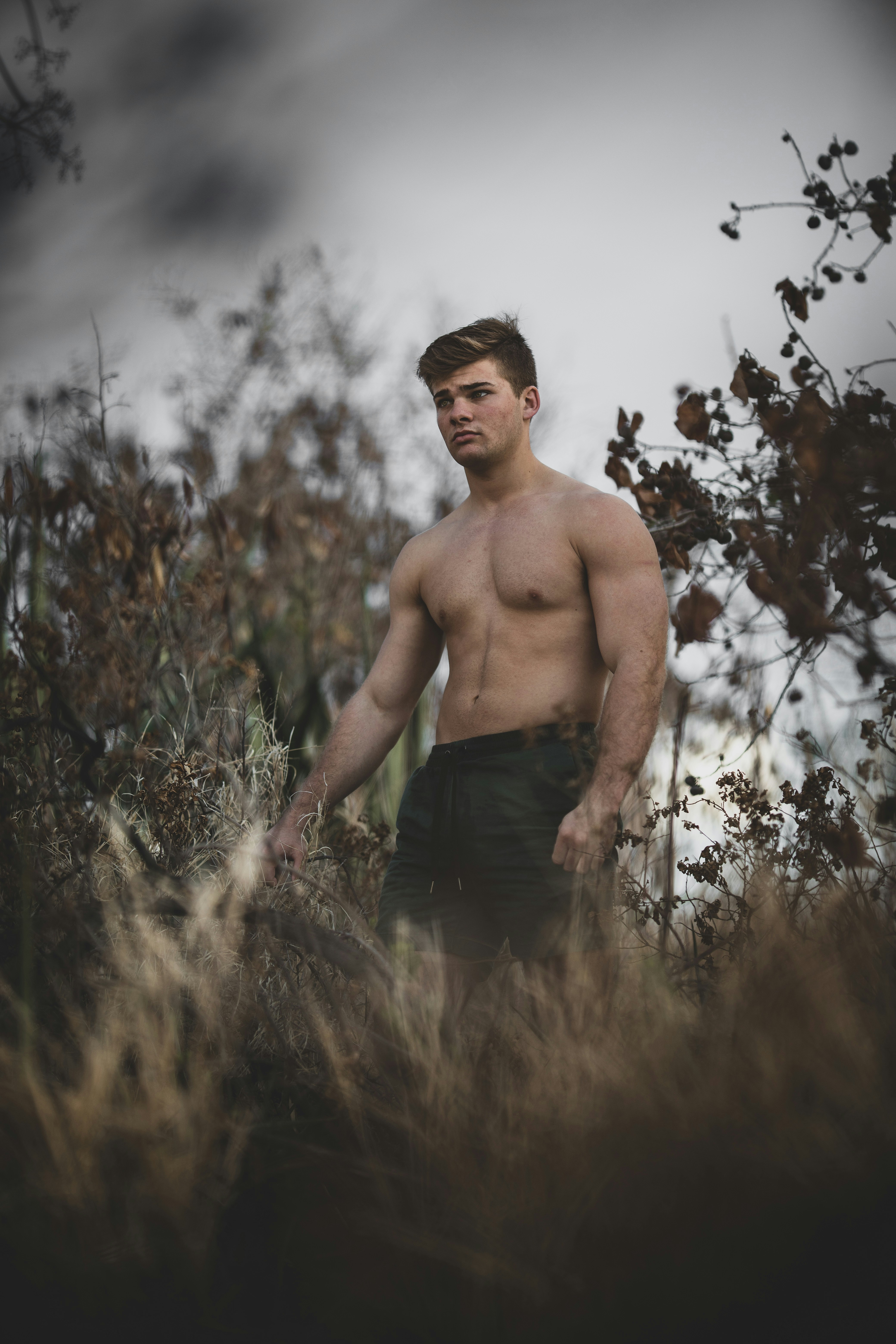 Stand at the Dry Edge: Portrait of Quiet Resolve in a Wind-Scattered Field
