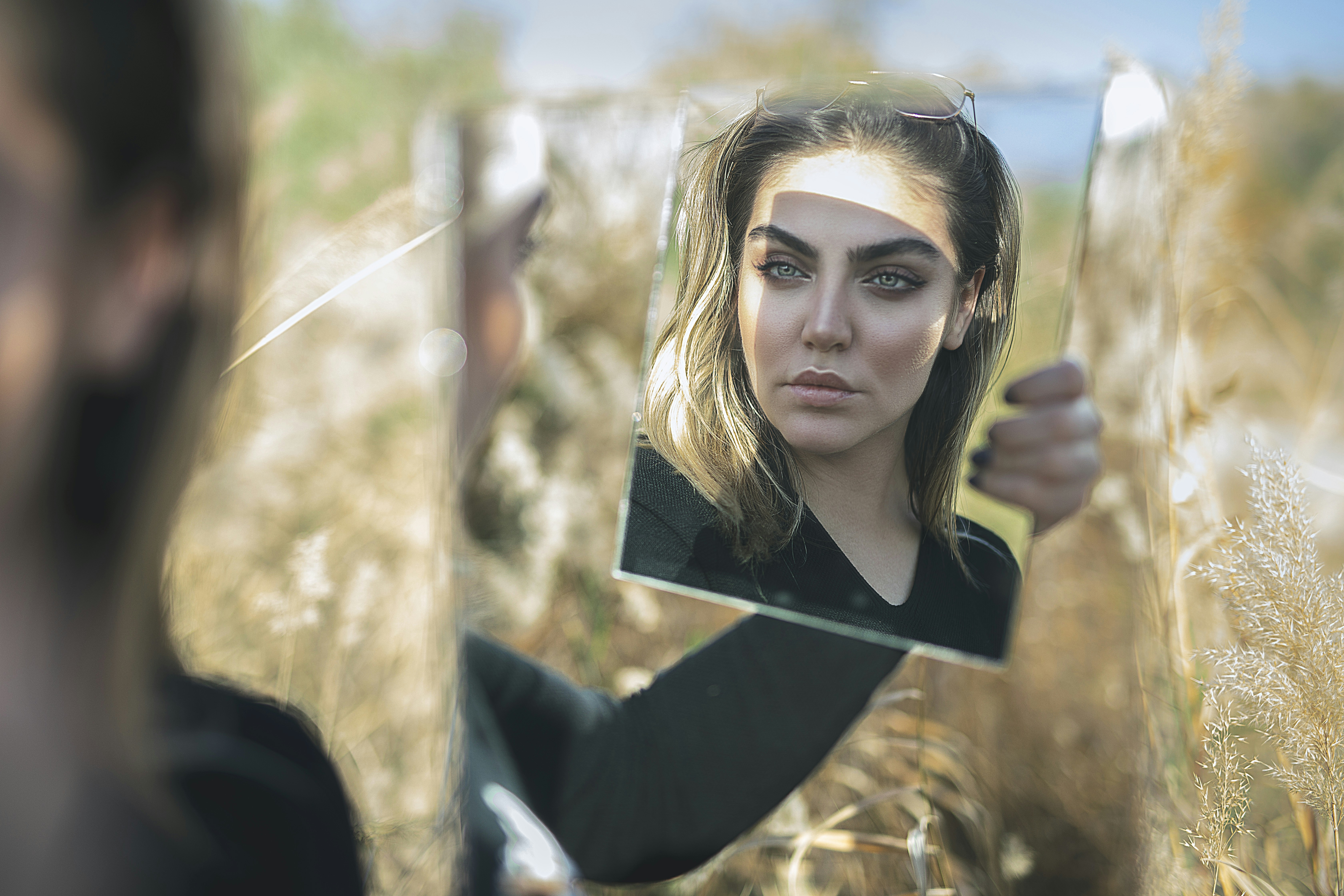 Meadow Gaze Reflected: Portrait Through a Handheld Mirror