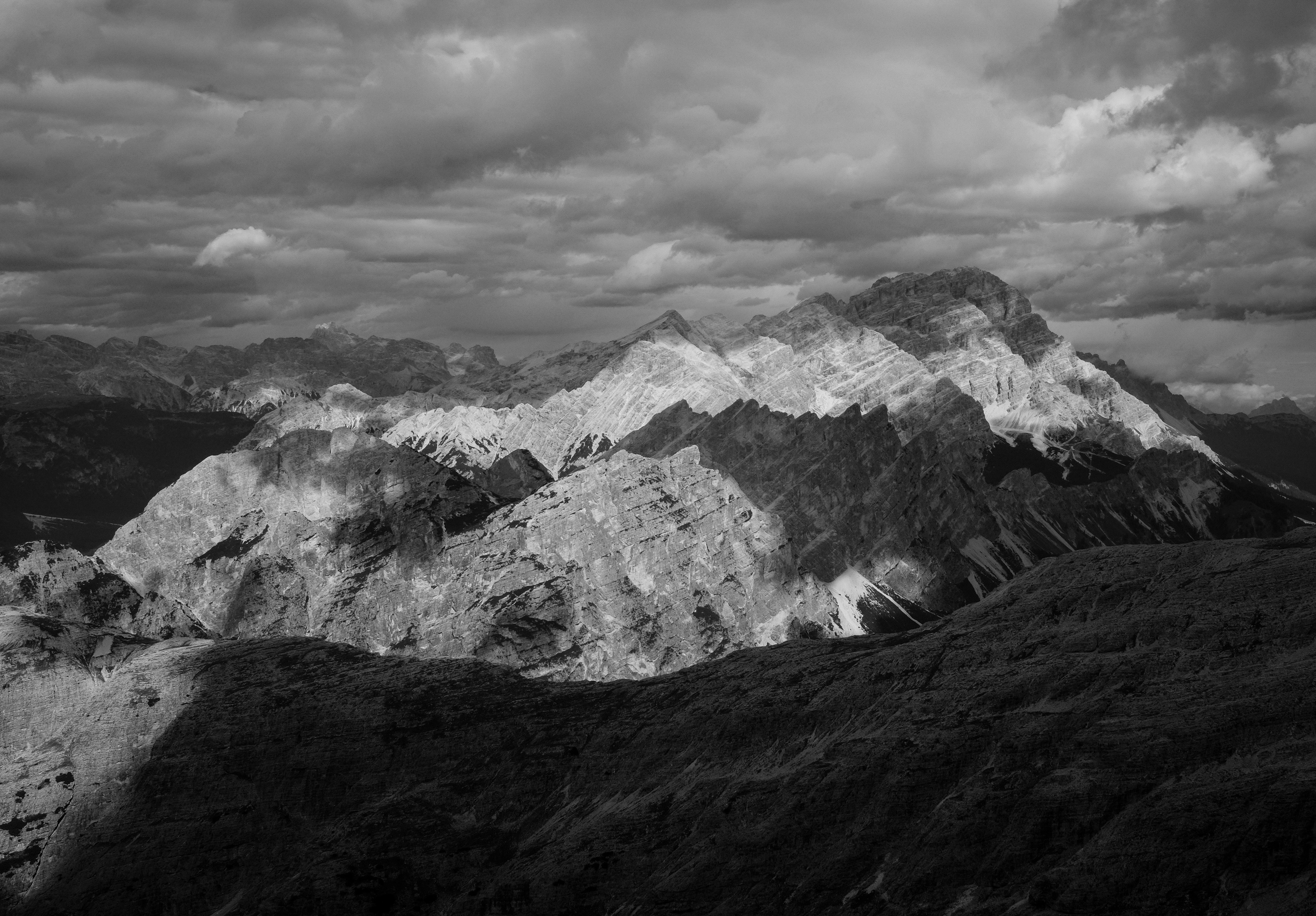 Grayscale photo of terrain under cloudy sky photo – Free Grey Image on ...
