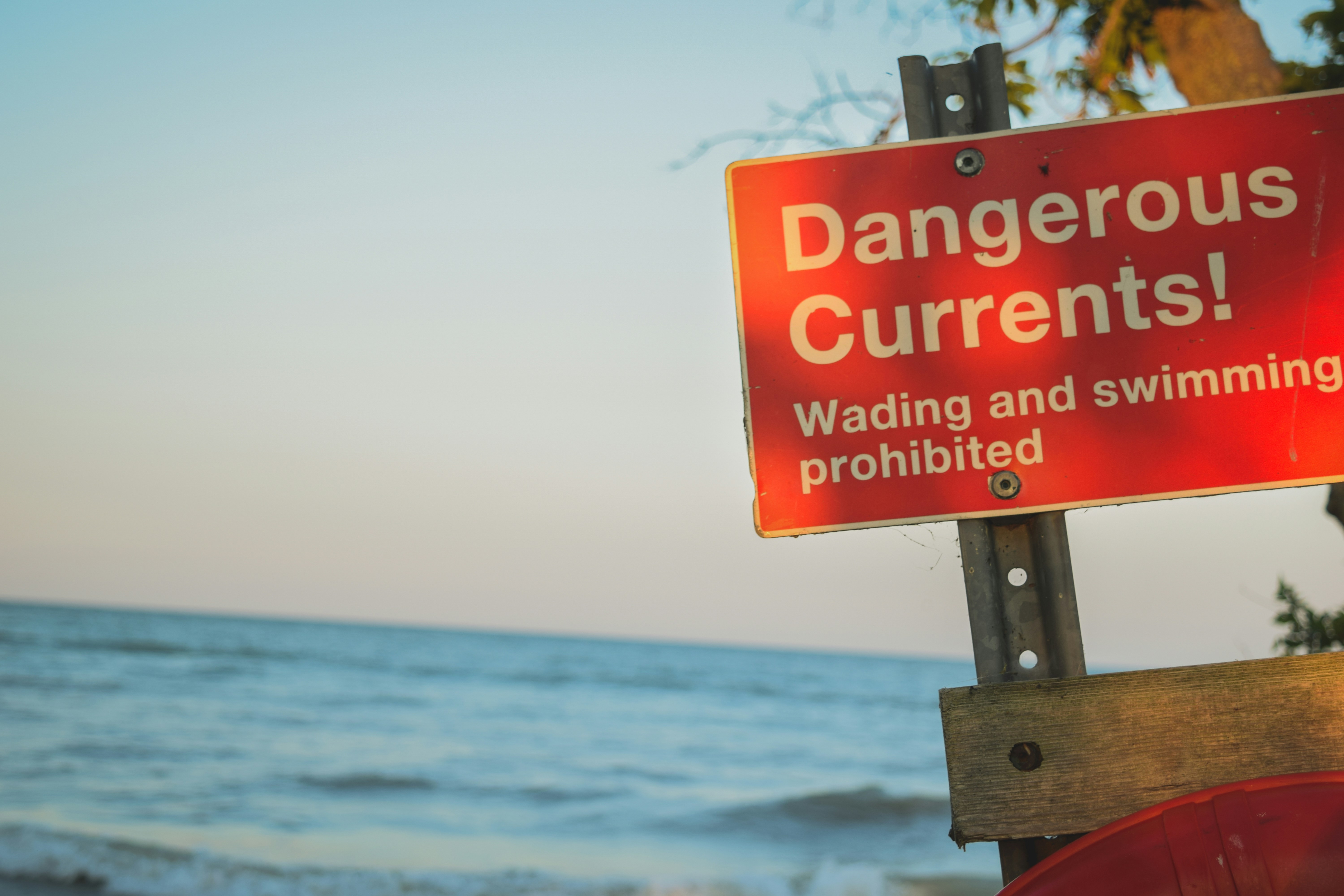 Dangerous currents signage on wood photo – Free Symbol Image on Unsplash