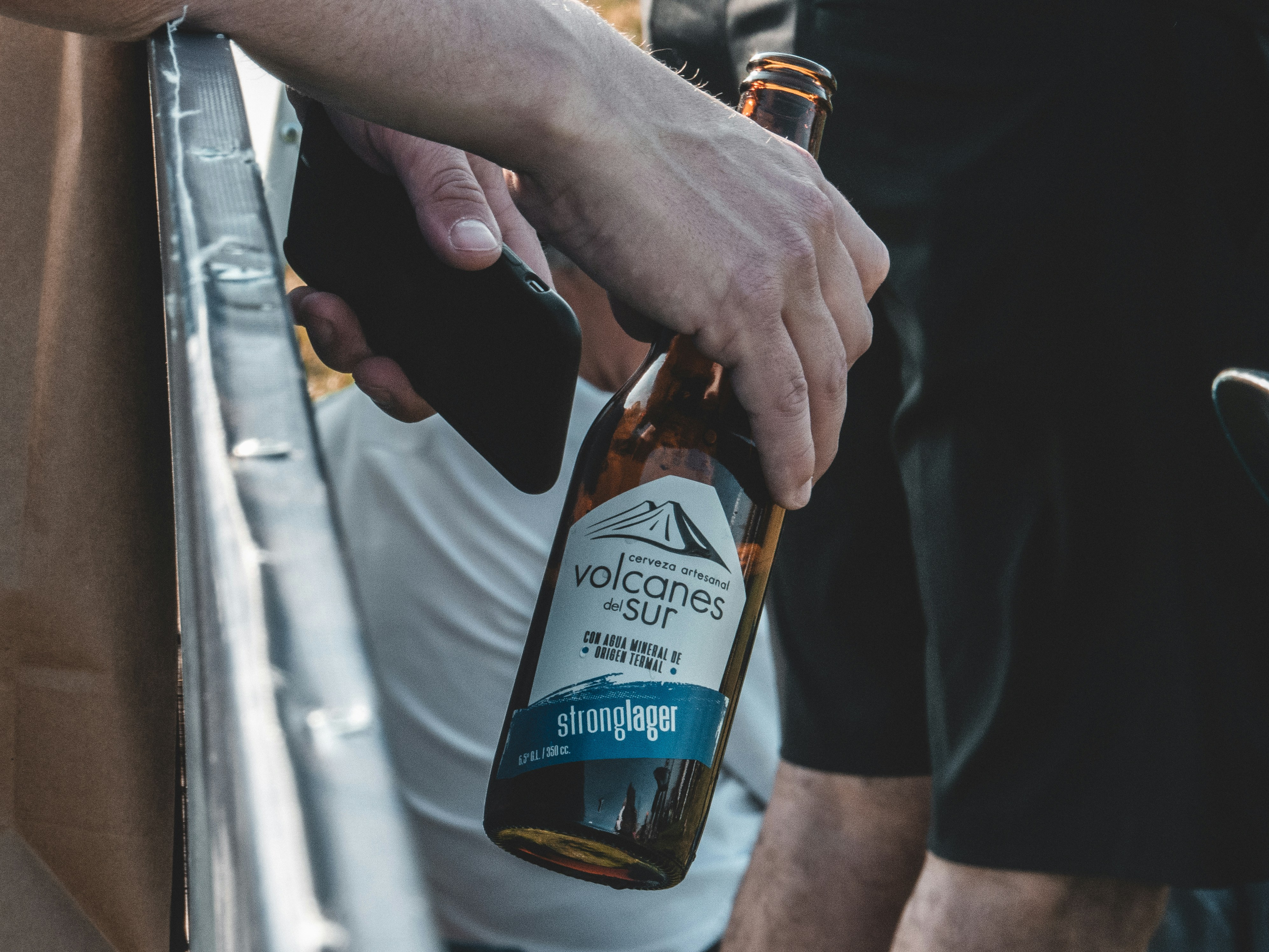 Edge-of-the-rail Lager: A Quiet Moment Amid Urban Hands