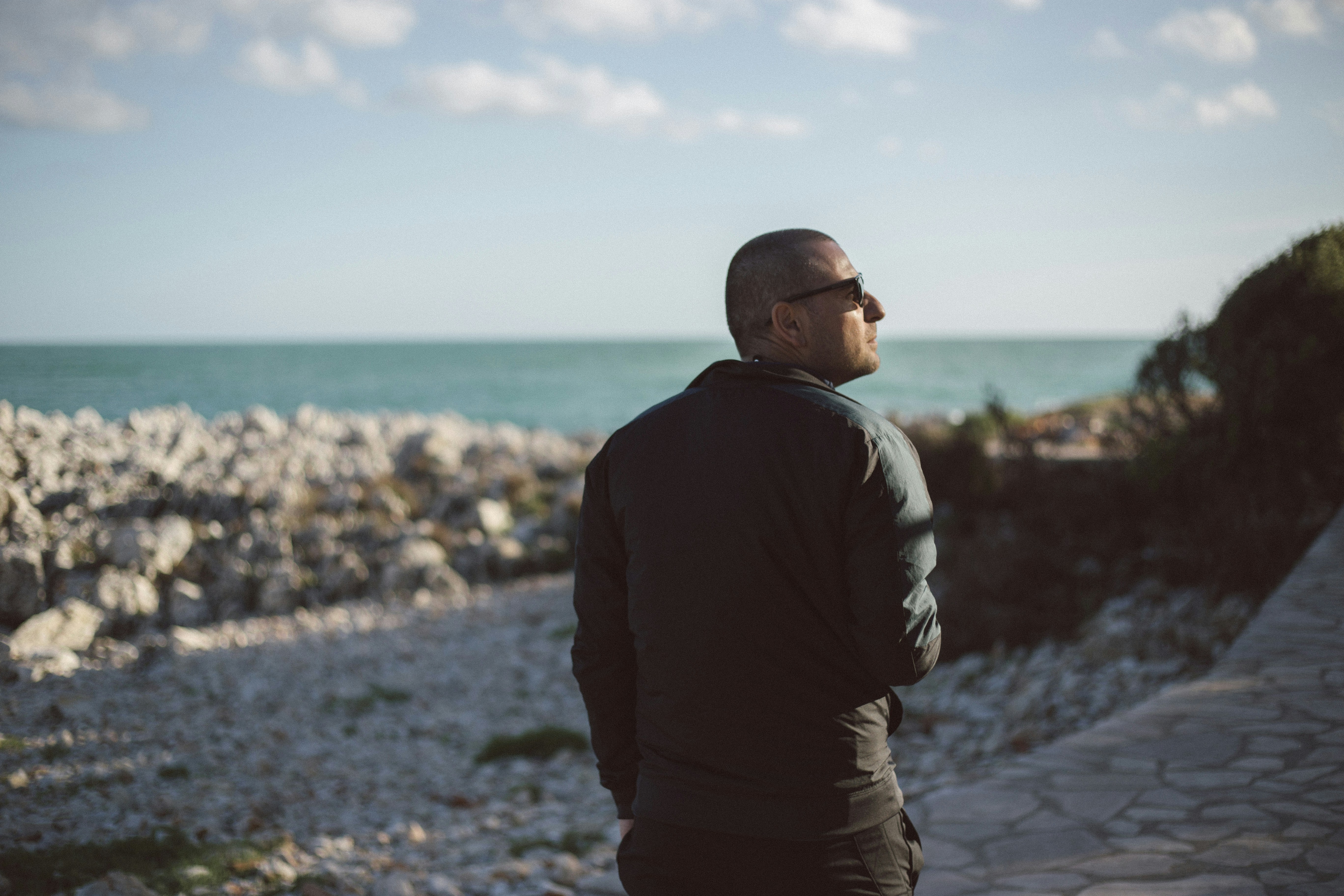 Coastal Gaze: A Quiet Portrait by the Sea