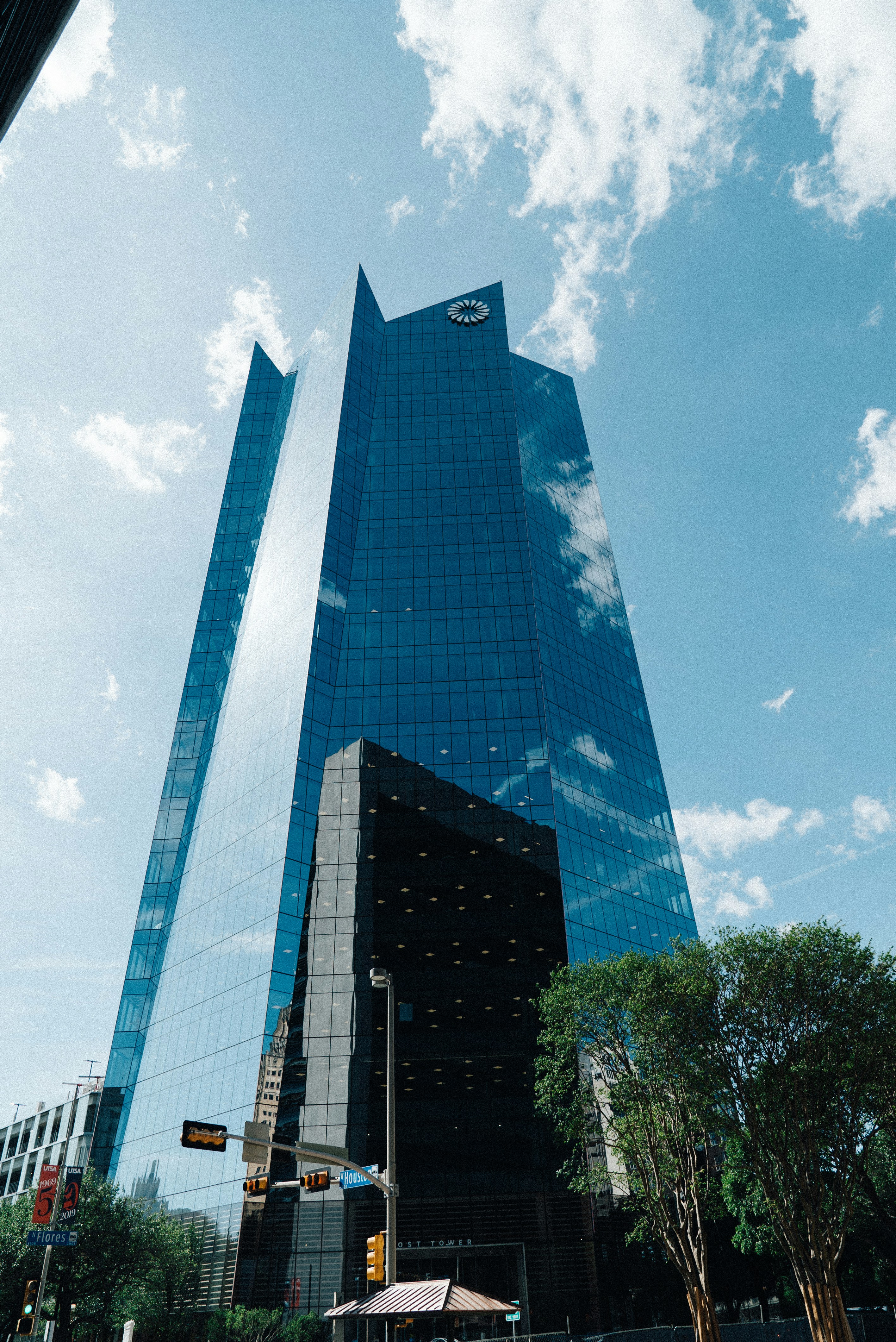 Low-angle photography of blue high-rise building during daytime photo ...