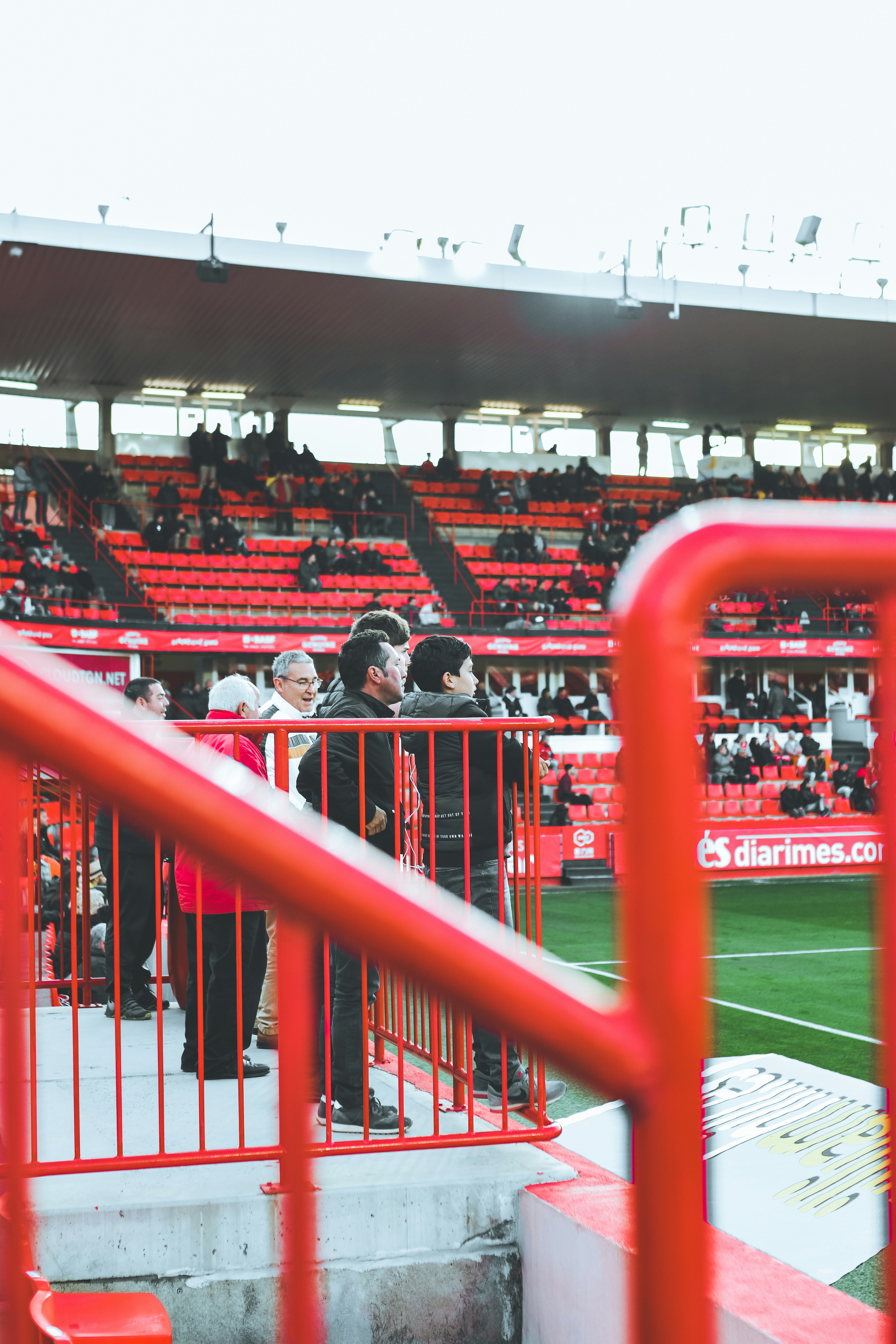 People watching game photo – Free Railing Image on Unsplash
