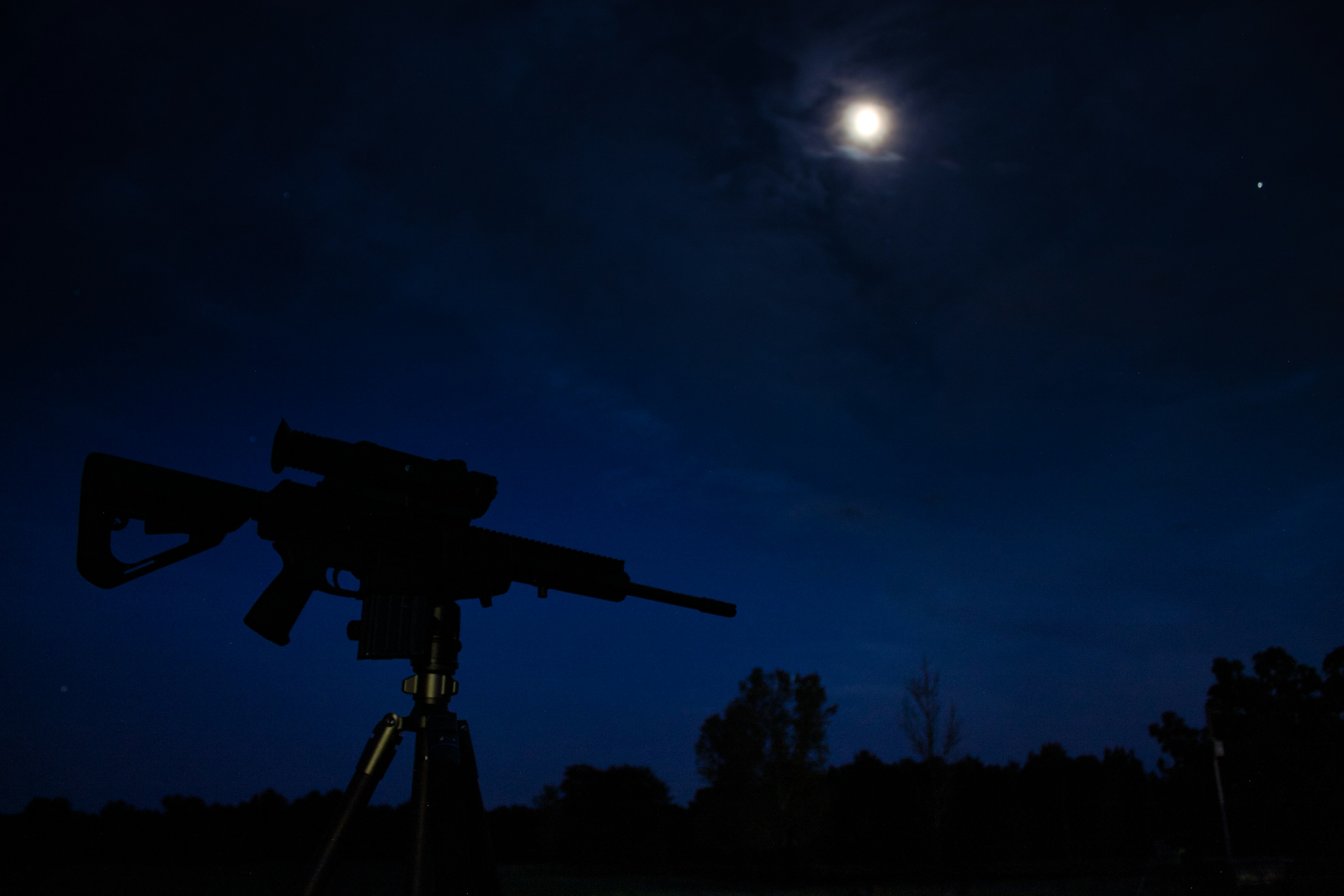 Moonlit Sentinel: A Lone Night Telescope Against the Evening Sky
