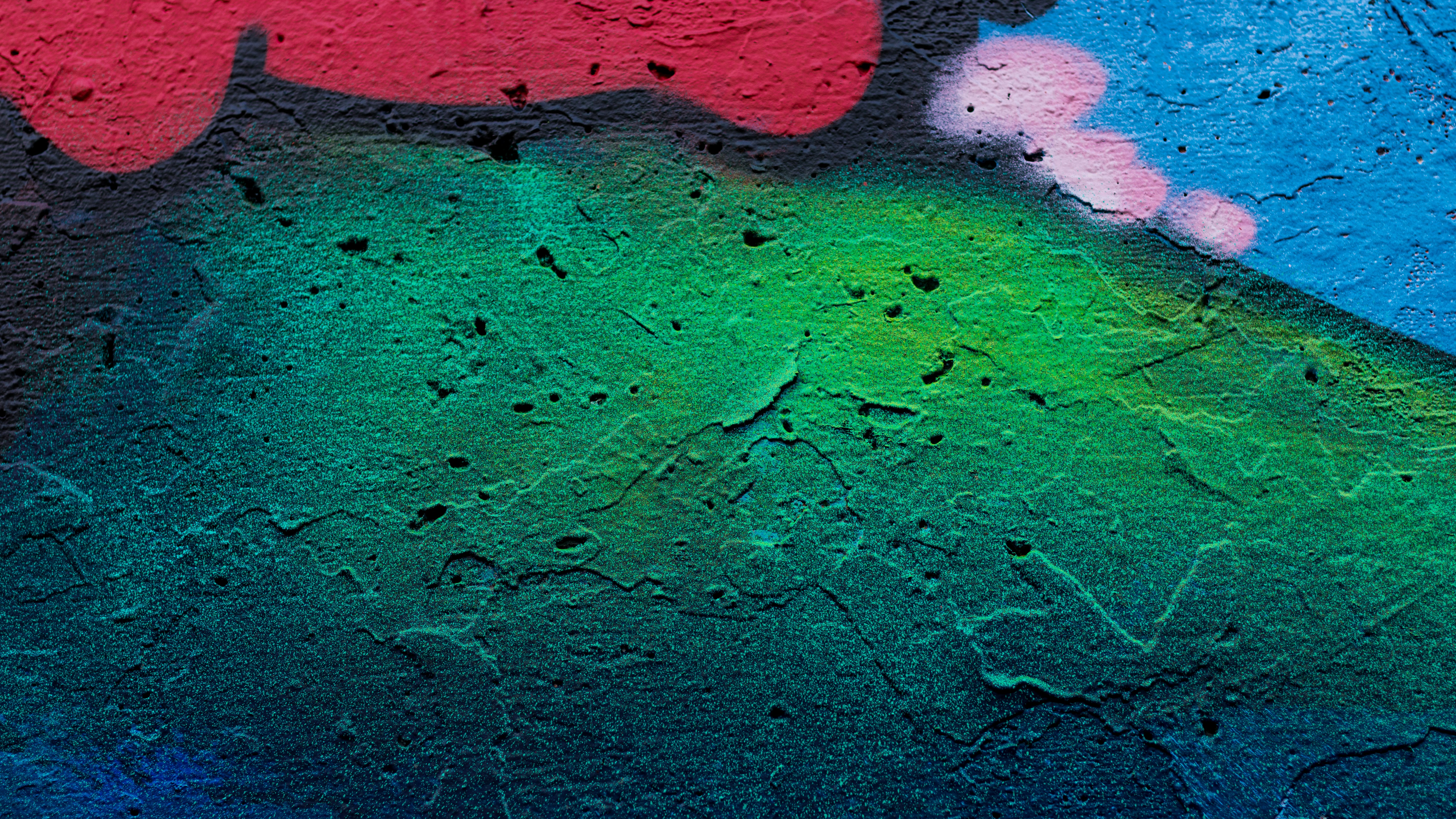 a wall with a colorful painting on it