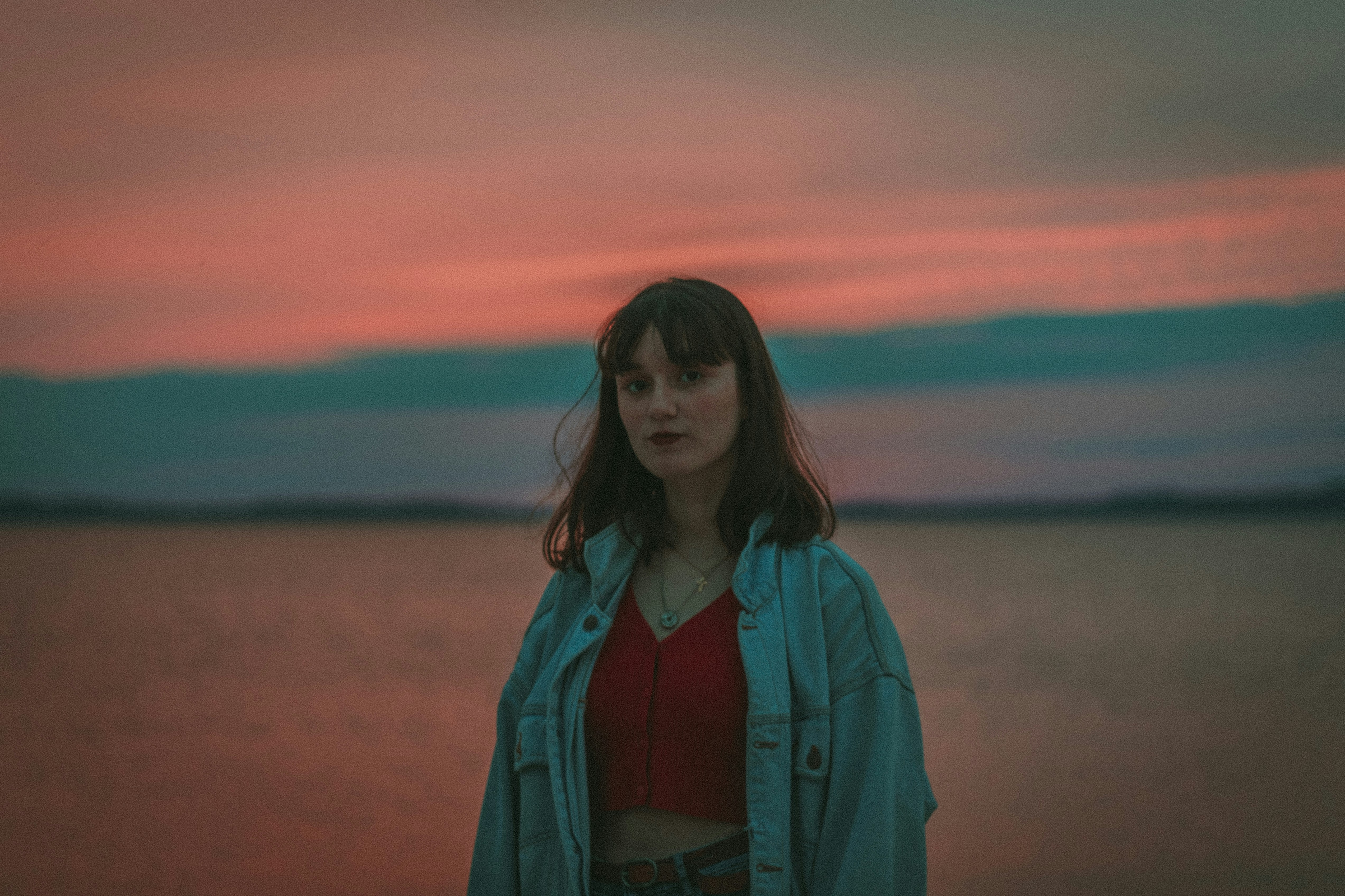 Crimson Hour: Quiet Shore Portrait in Sunset Pink