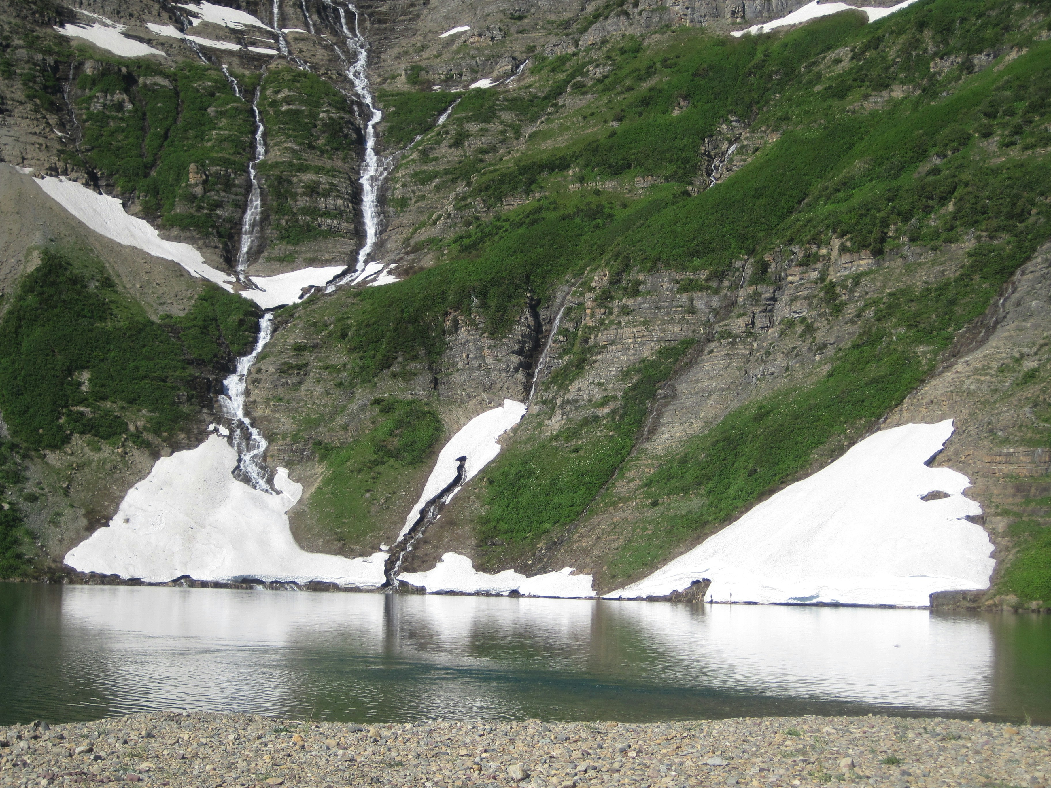I snapped this photo during our Back Country backpacking trip in Glacier National Monument.  We were 8 miles from civilization.  

In the middle of the night, we would wake up to the thundering roar of avalanches all around us.