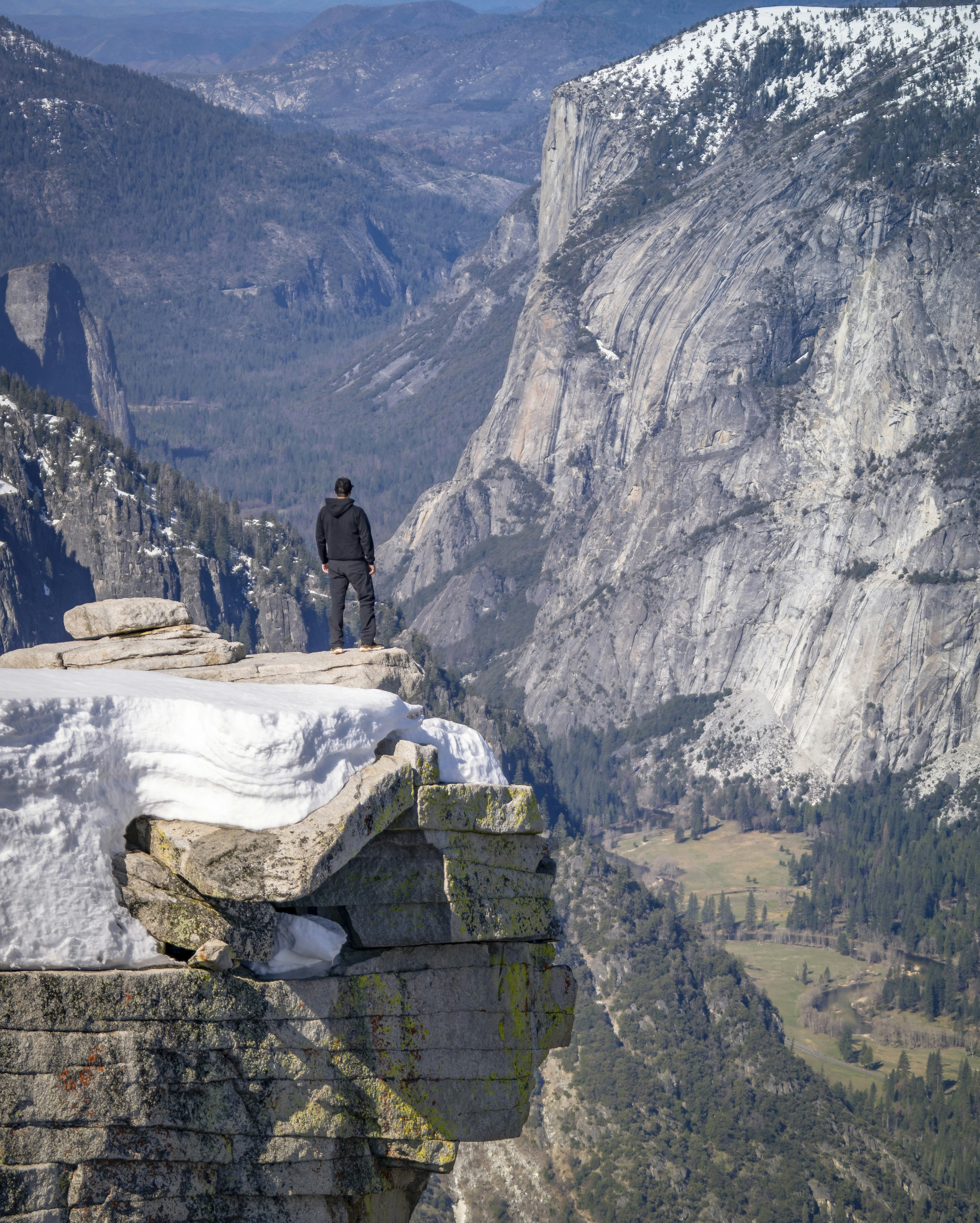 man standing on cliff
