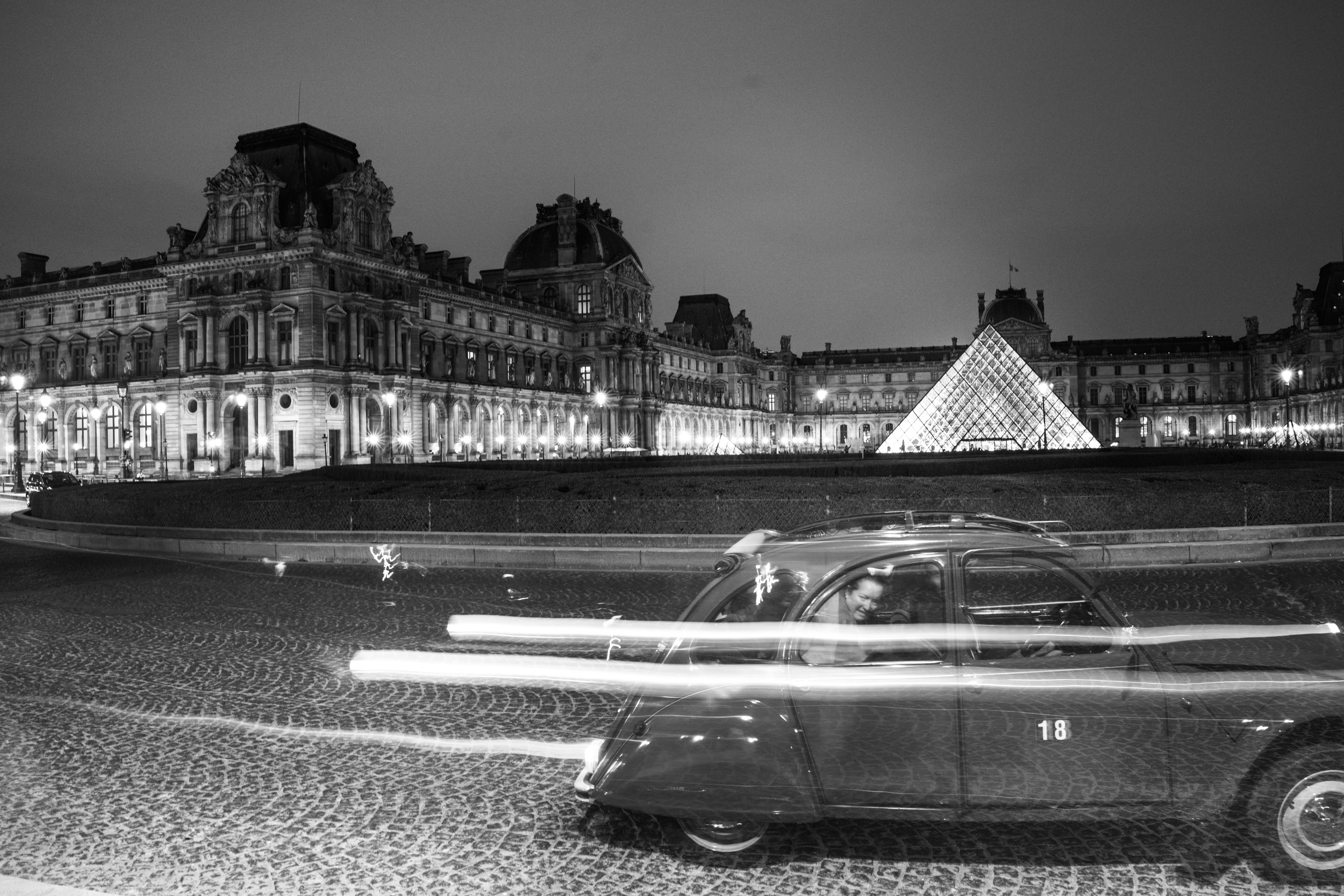 Volkswagen beetle on road in grayscale photo