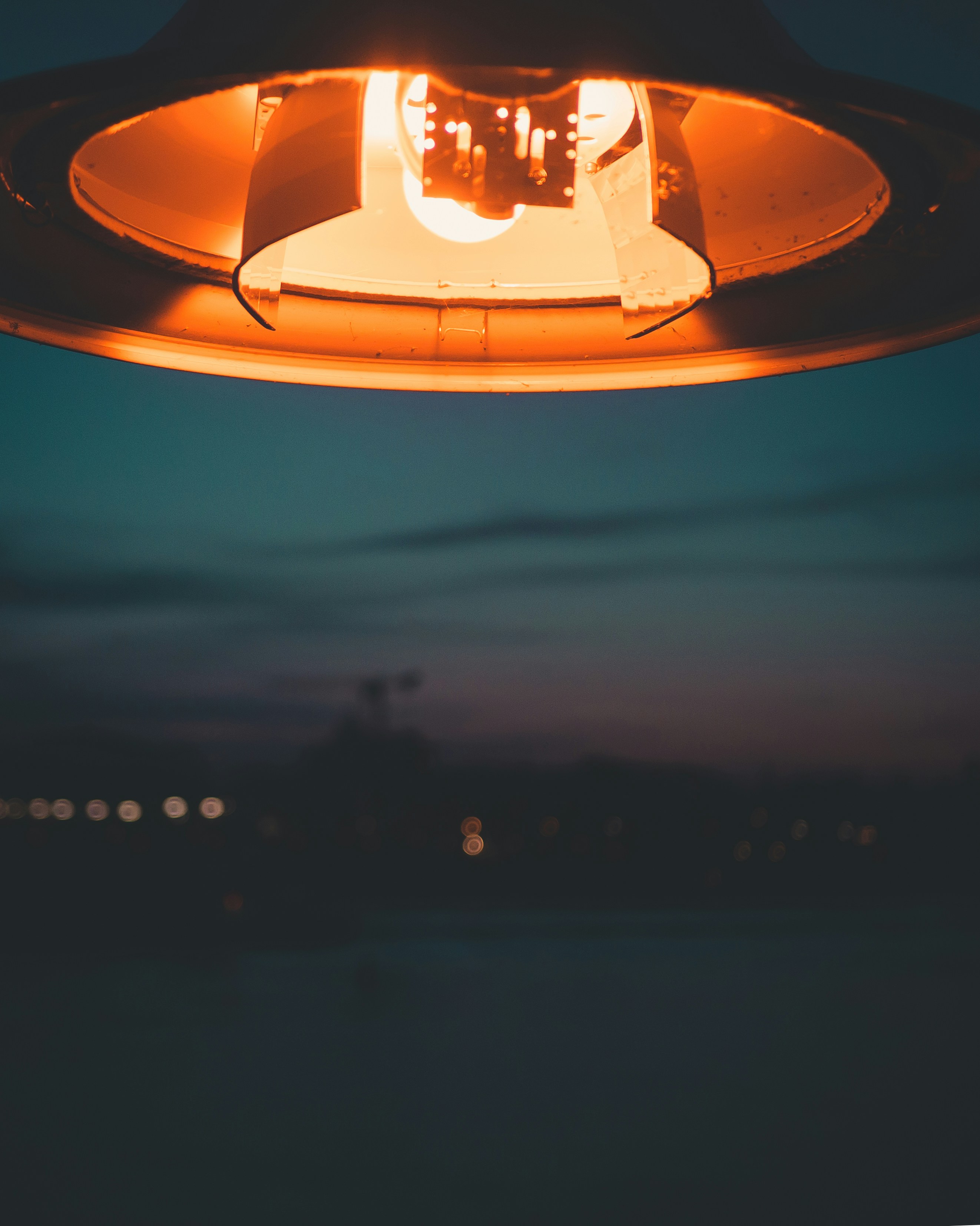Amber Halo Over a Quiet Dusk Harbor