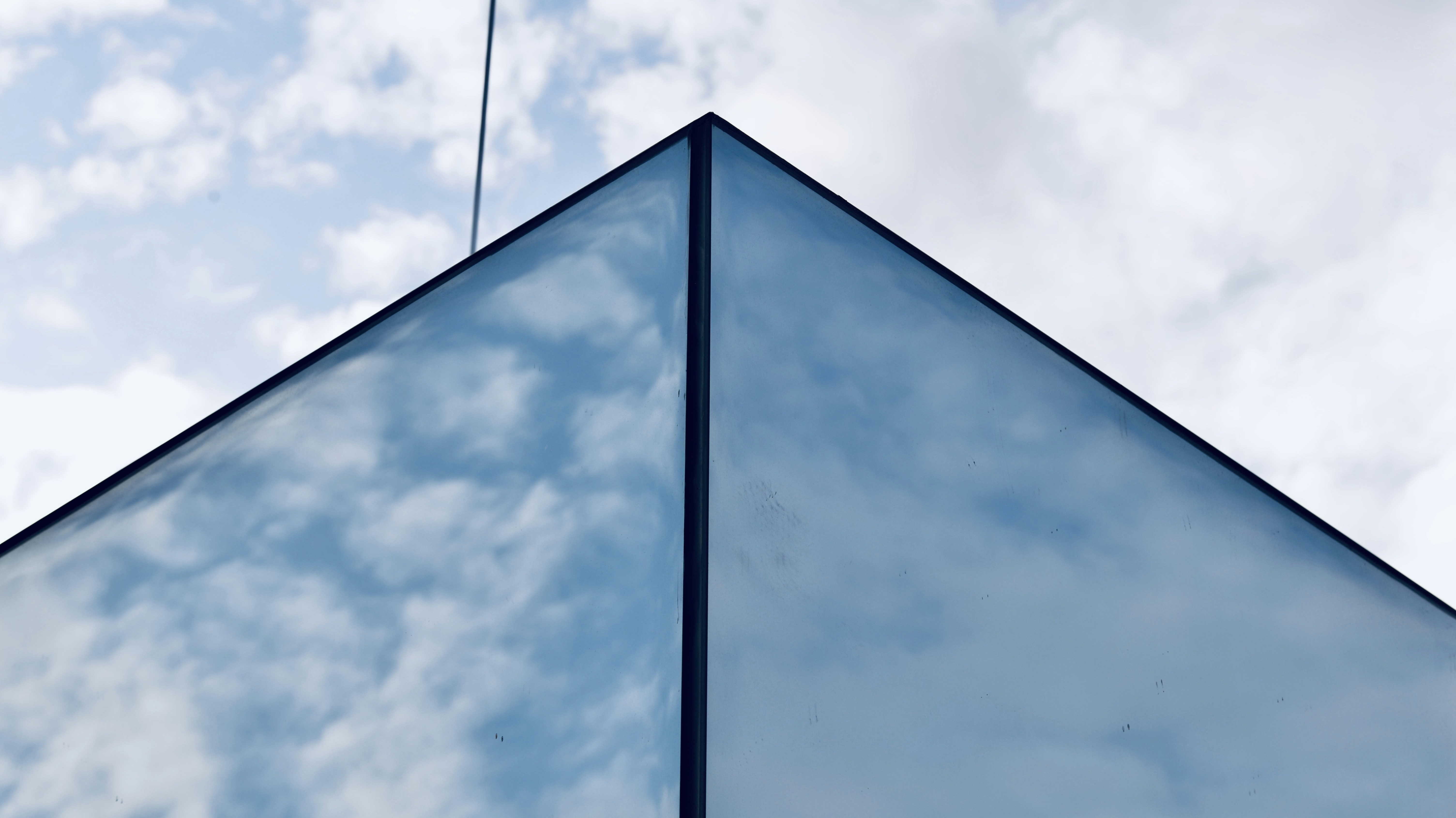 Black metal frame pyramid building photo – Free Blue Image on Unsplash
