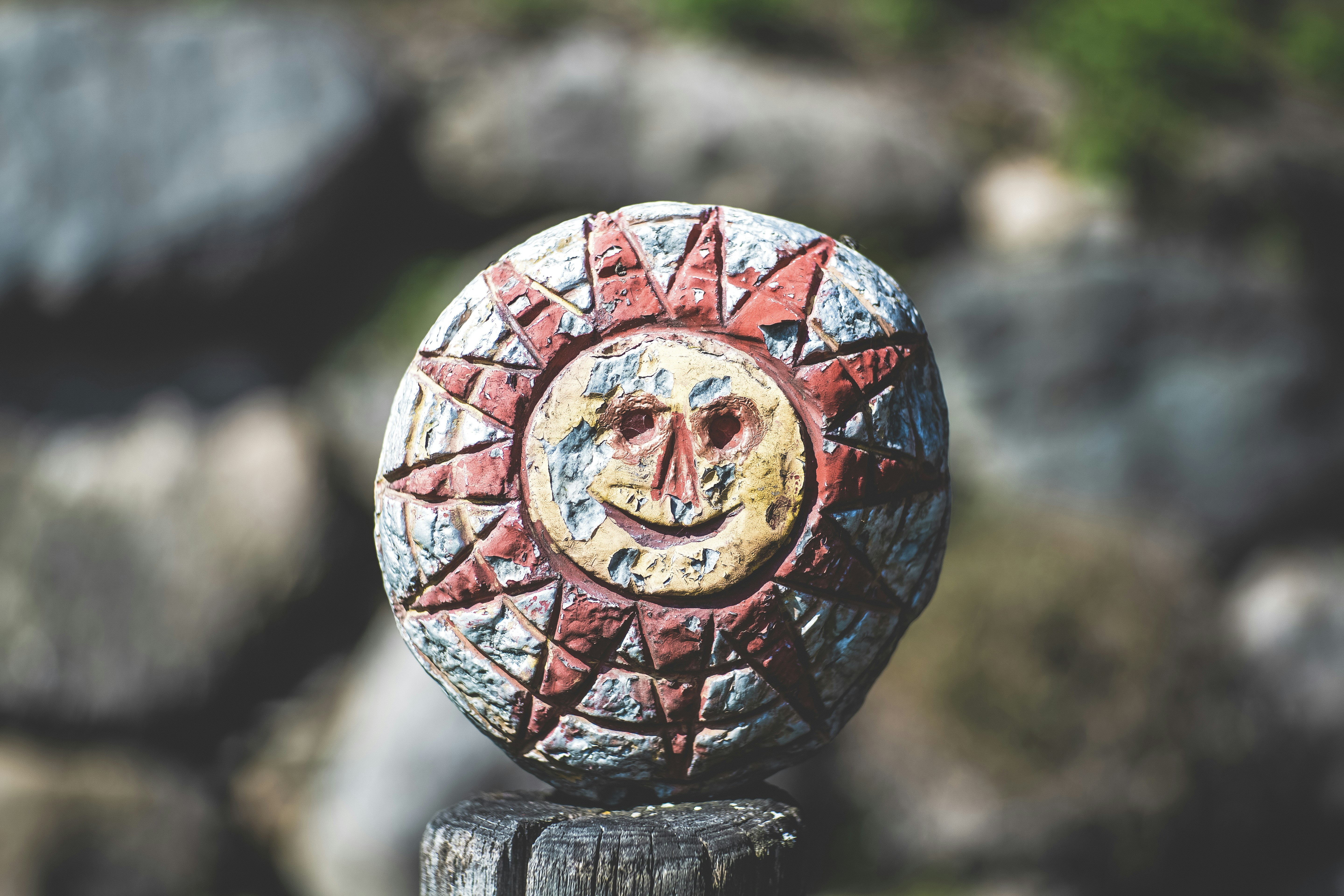Smiling Sun on a Weathered Pedestal