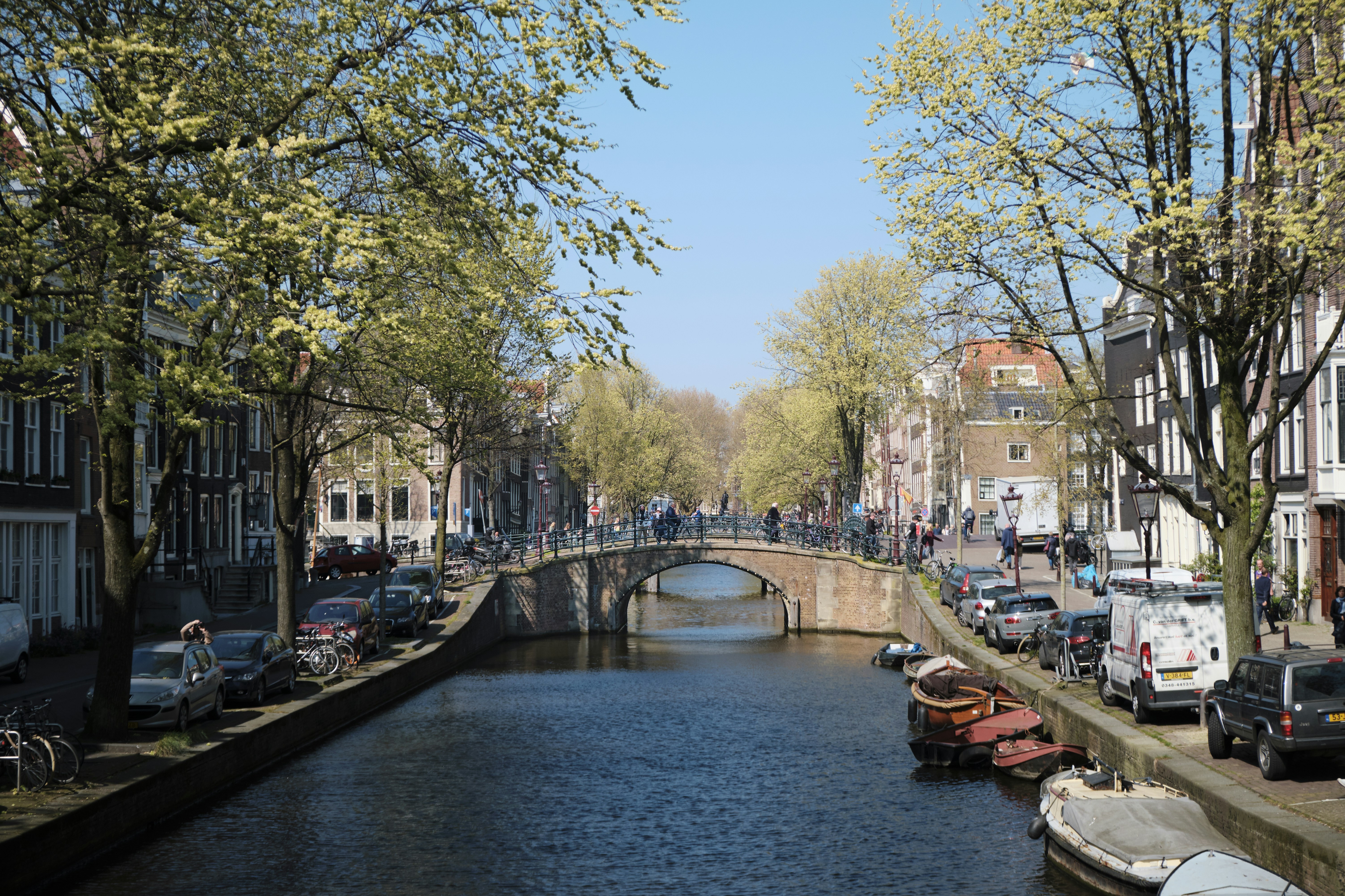 The famous canals in Amsterdam. | concrete bridge during daytime