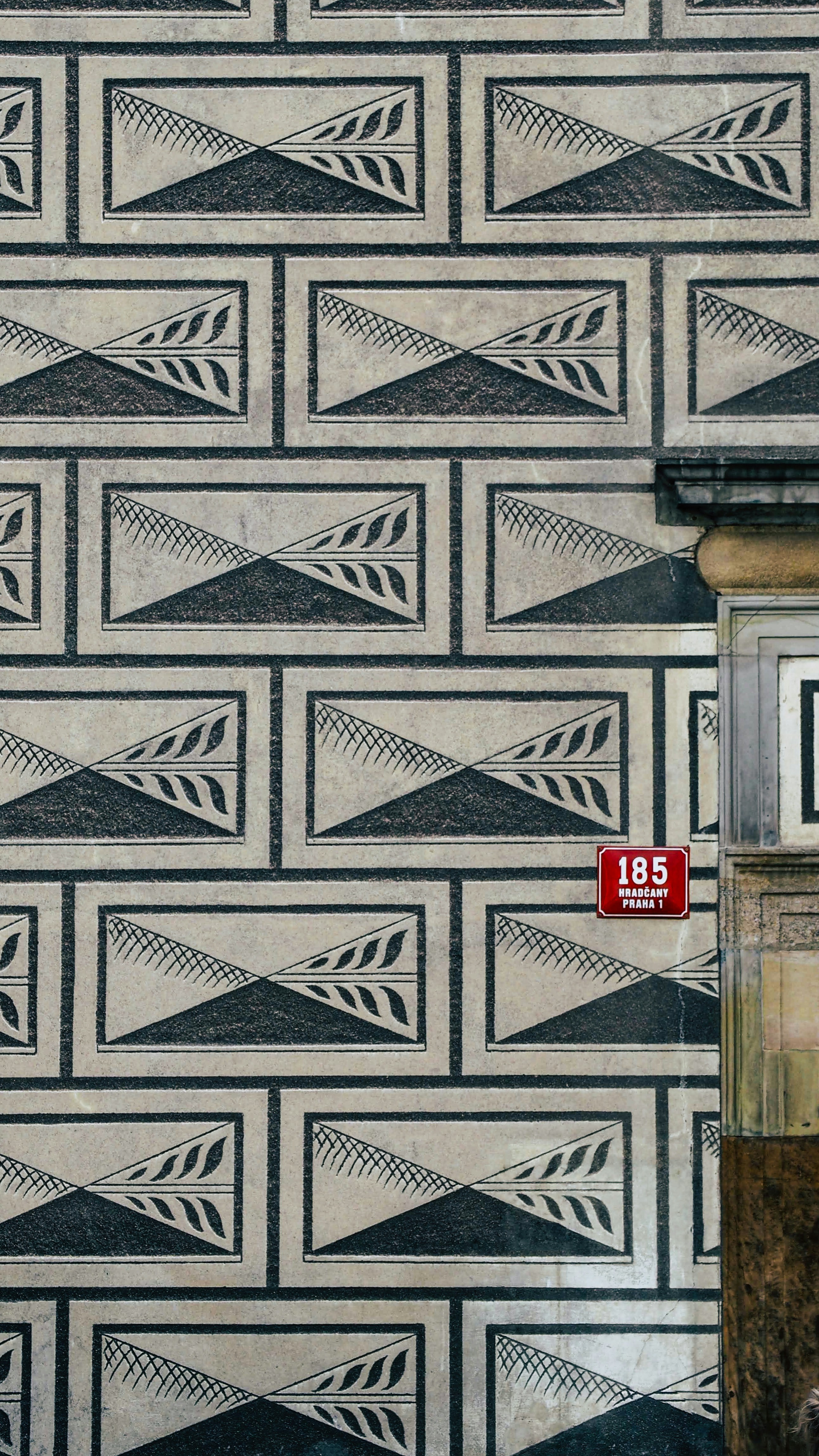 Red 185 Among the Geometry: A Wall of Repeating Diamond Tiles