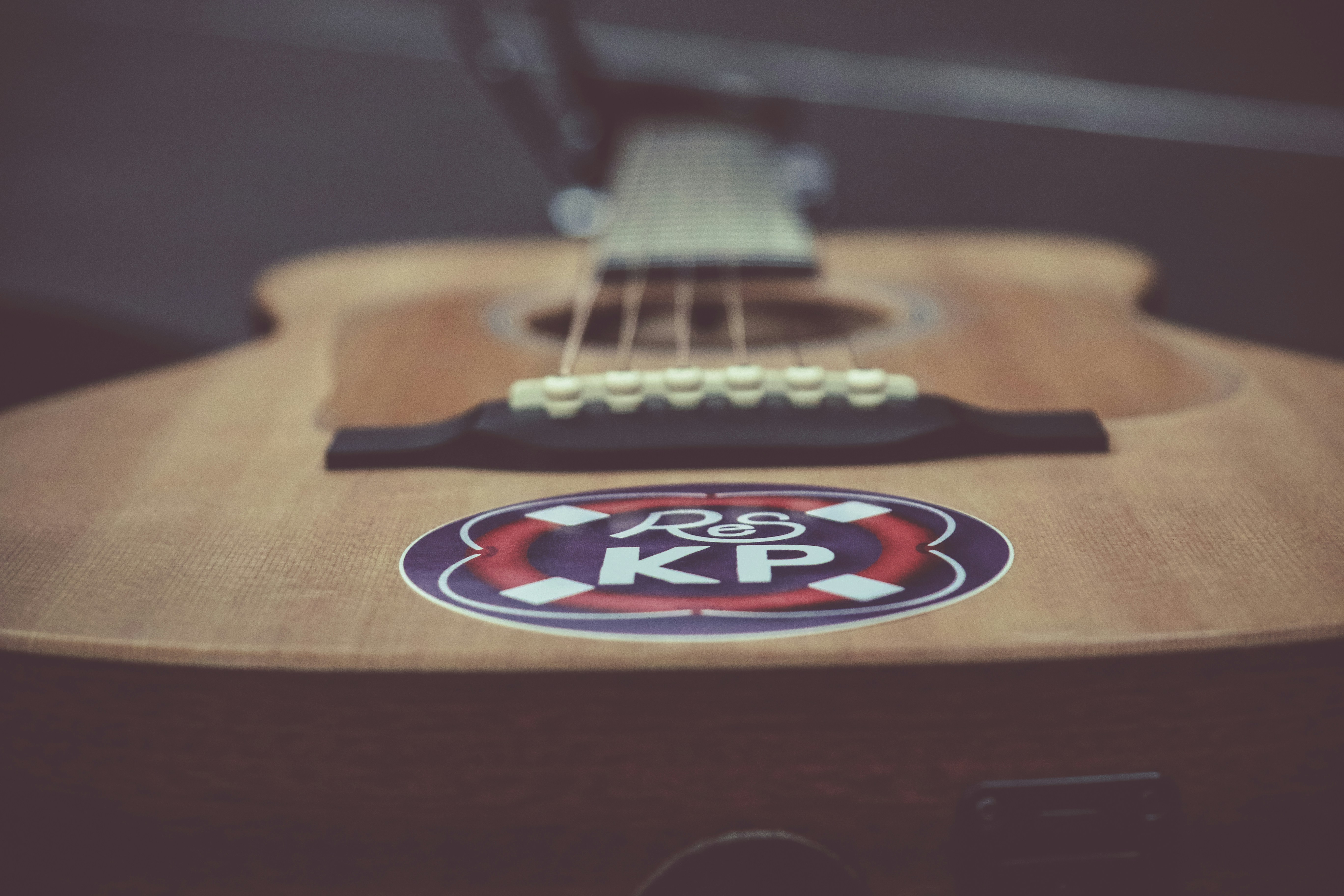 Staged Acoustic Guitar with a Central Sticker Accent