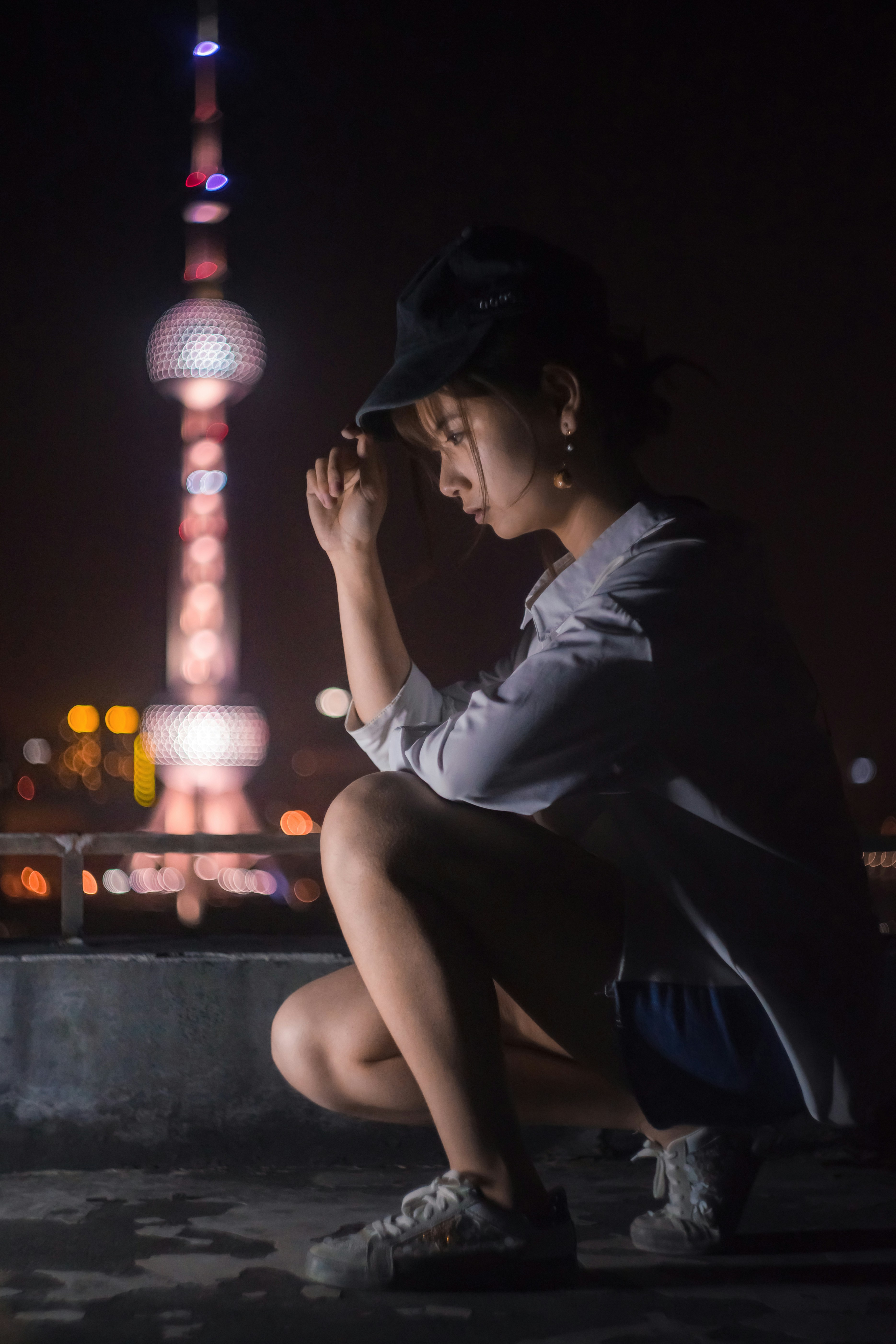 Neon Rooftop Quiet: Portrait Beneath the Night Tower