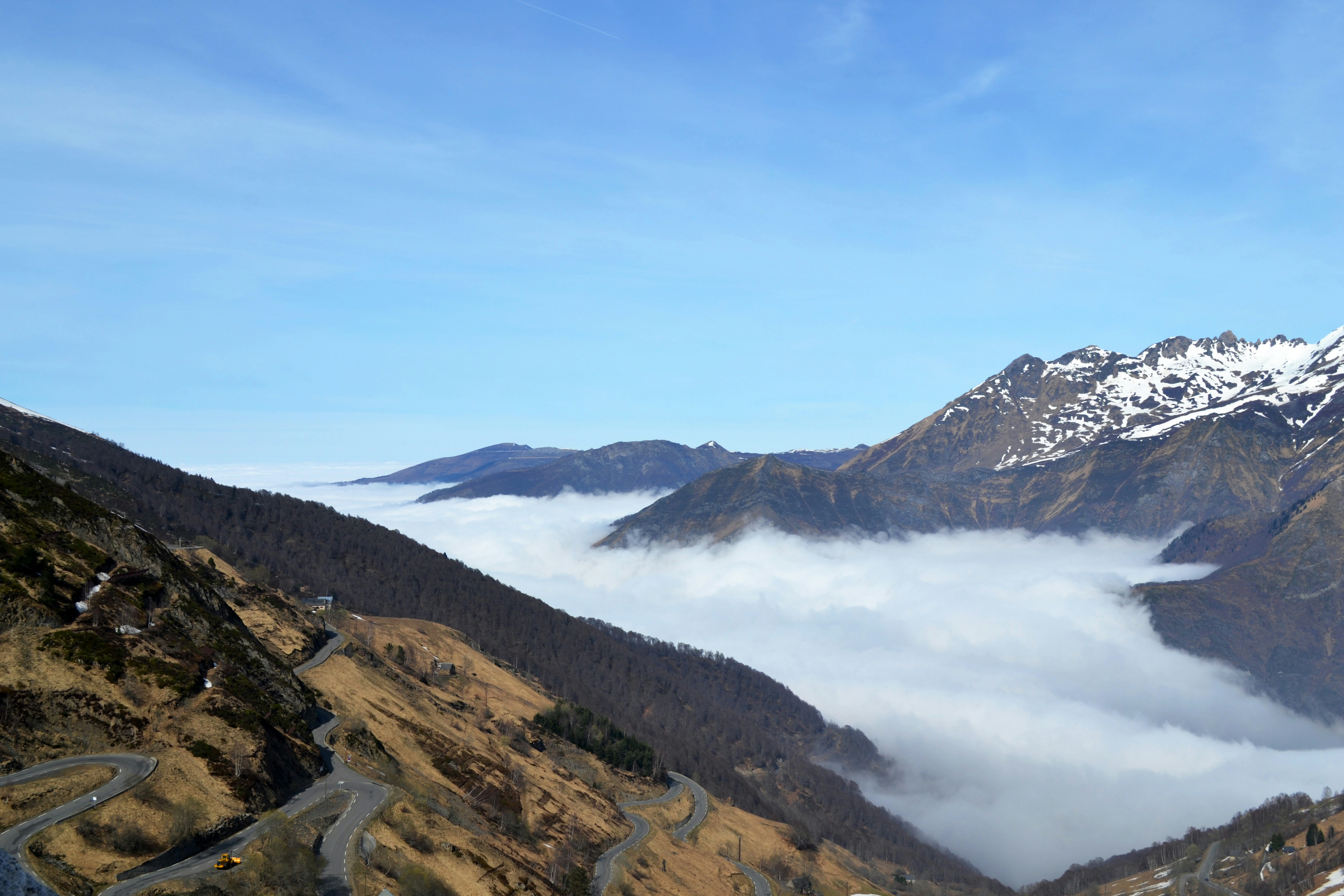 mountains with fog during daytime