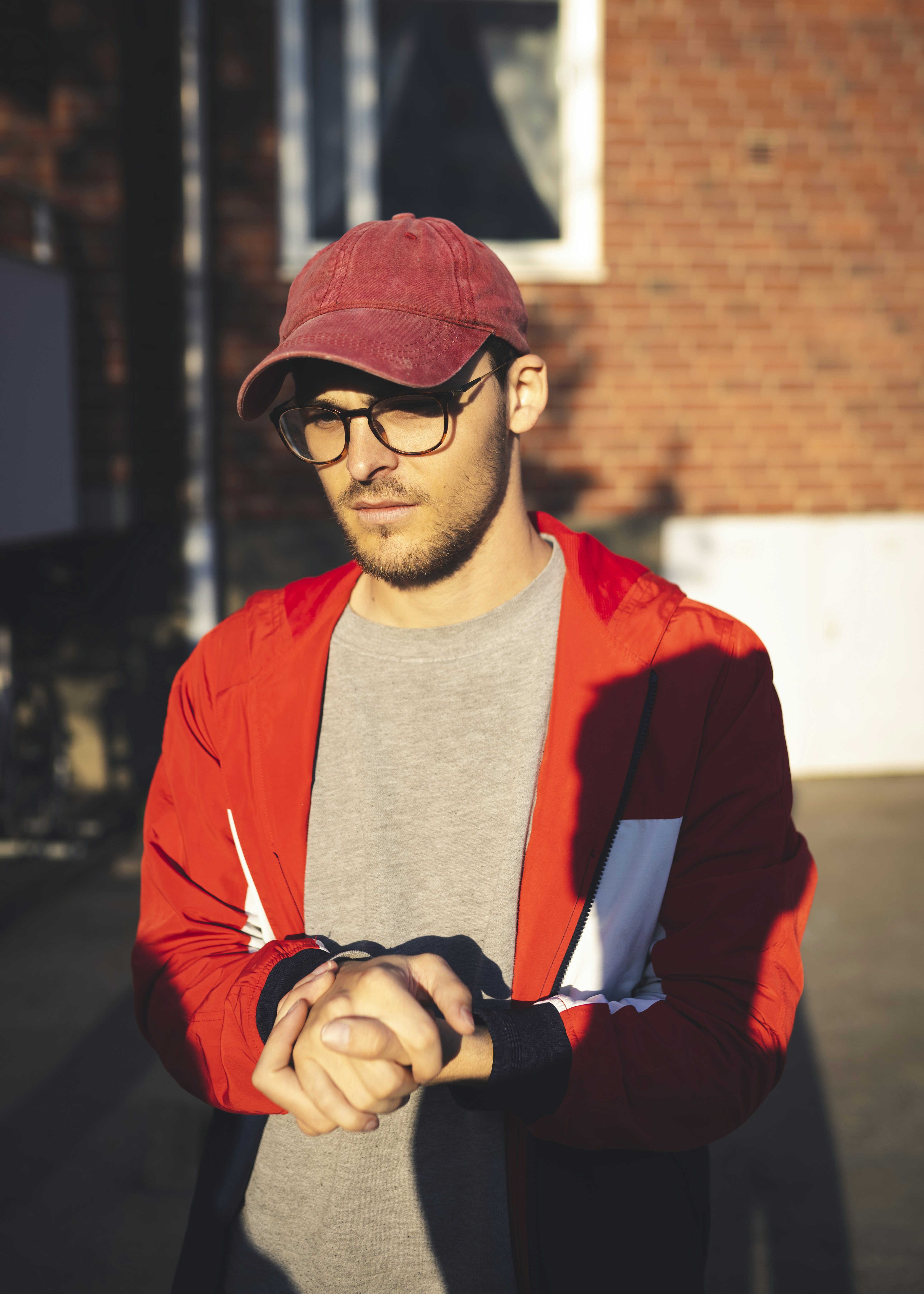 Man standing wearing red jacket photo – Free Human Image on Unsplash