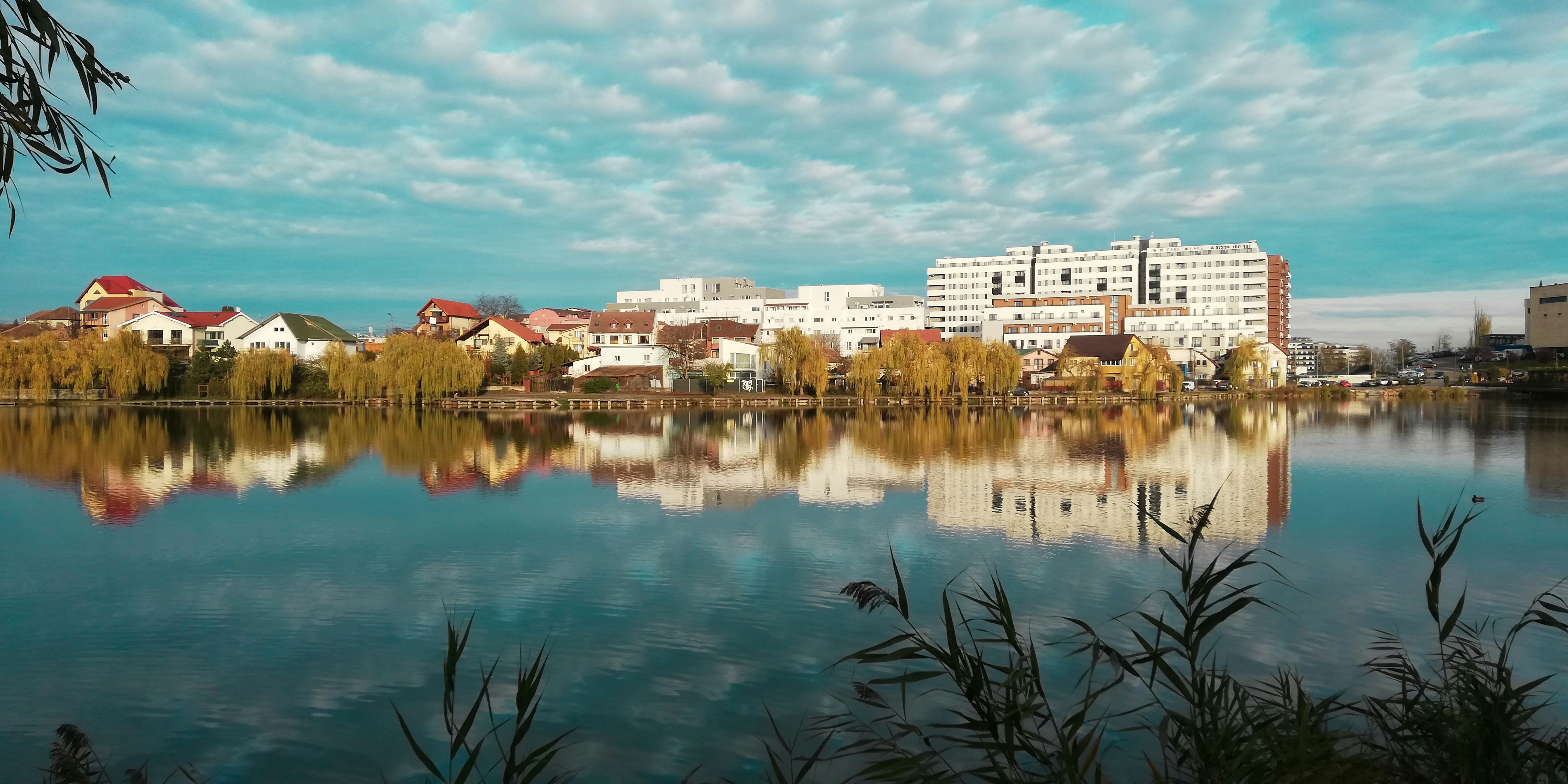white building near body of water
