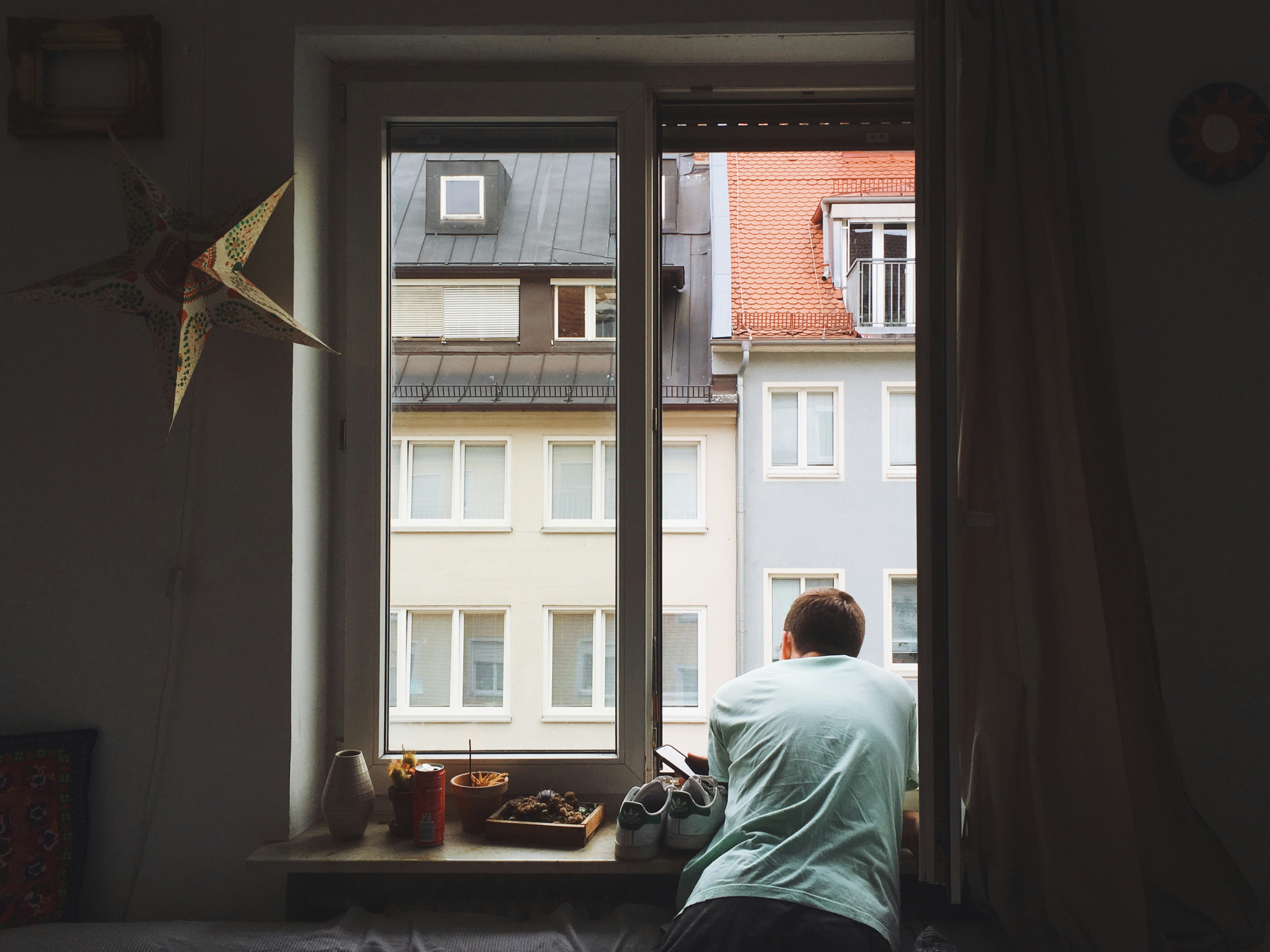Man near window photo – Free München Image on Unsplash