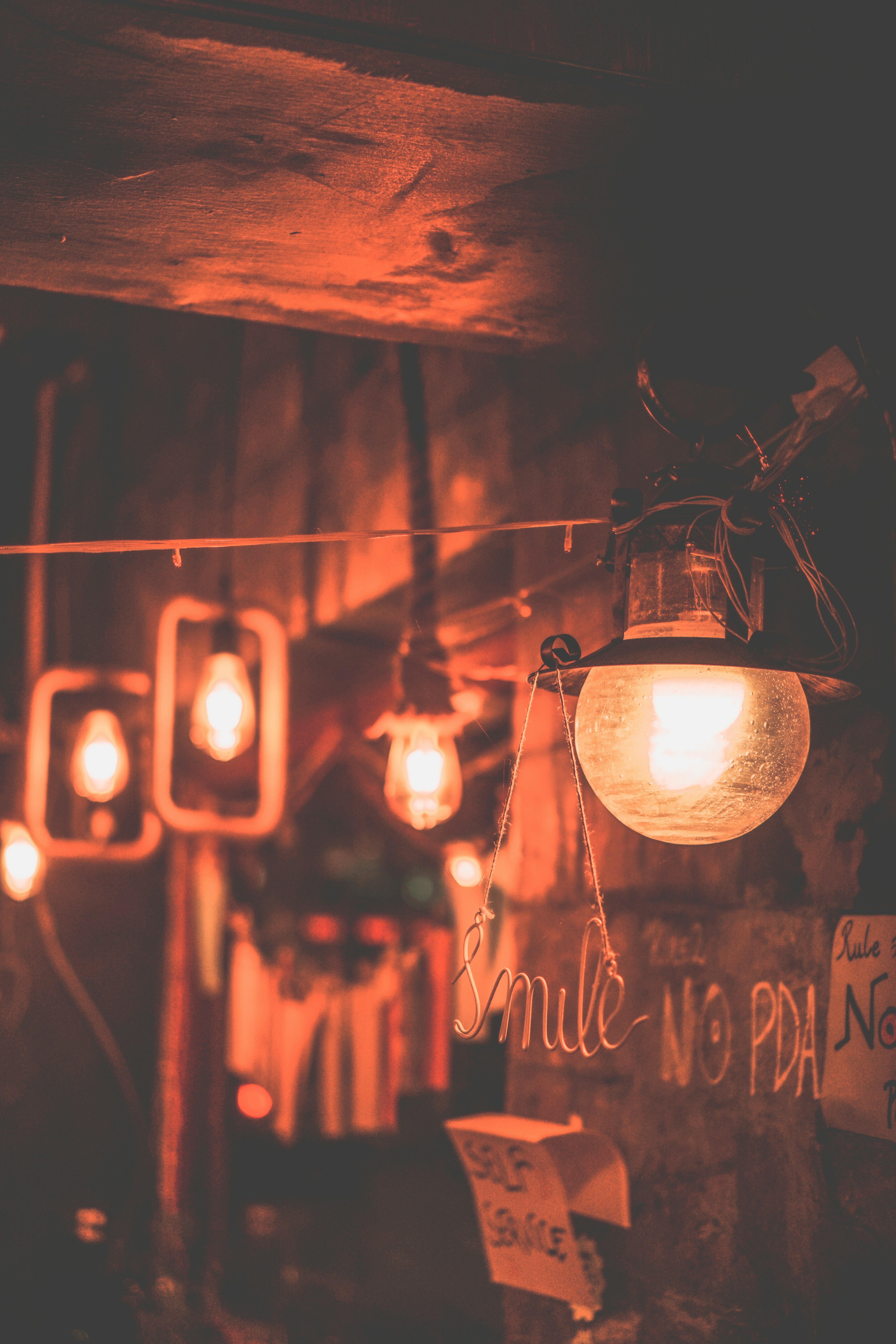 Amber Orbs Illuminate a Rustic Café Corridor