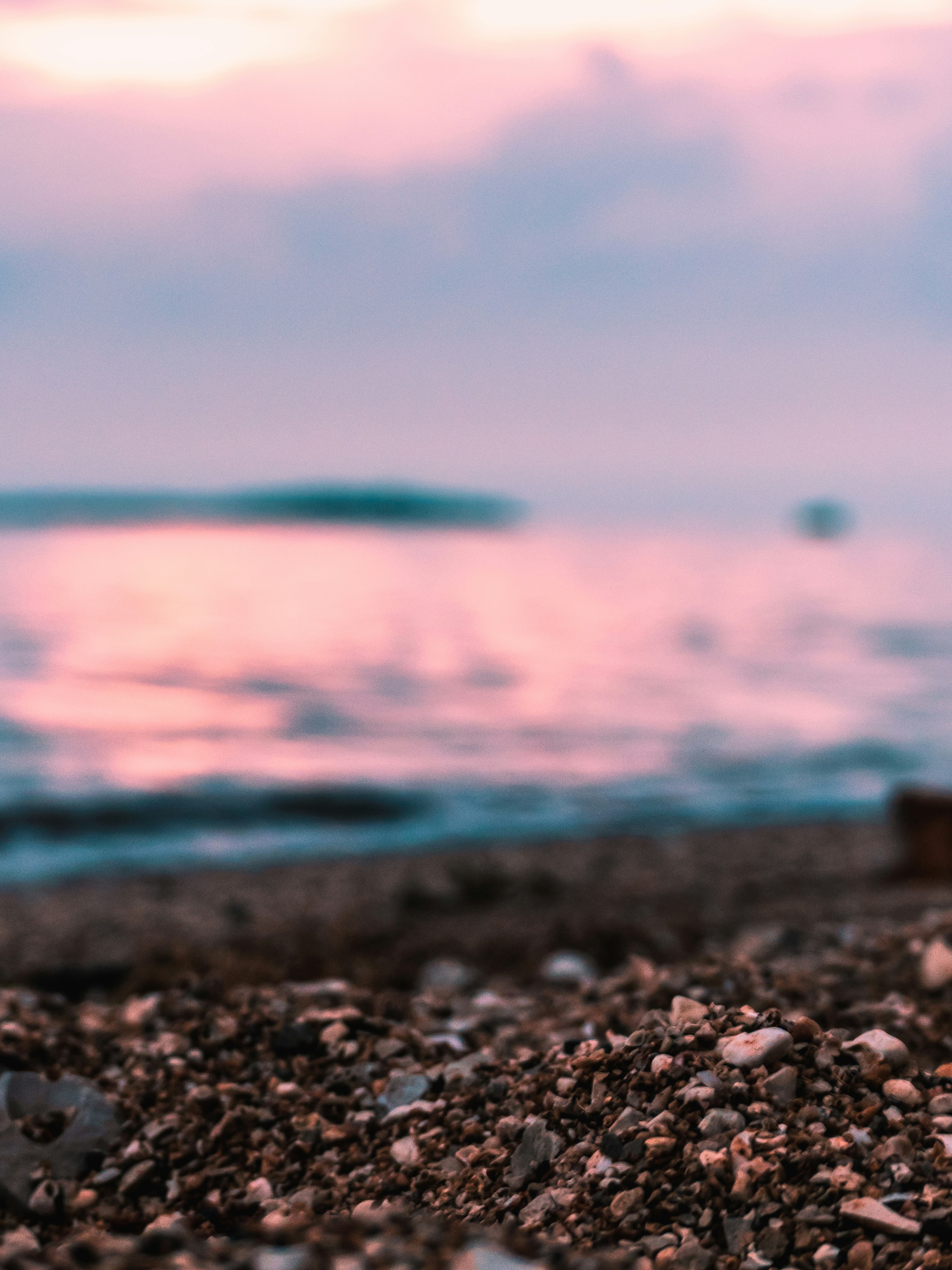 Blurred Shoreline at Sunset: Pebbles in Soft Focus