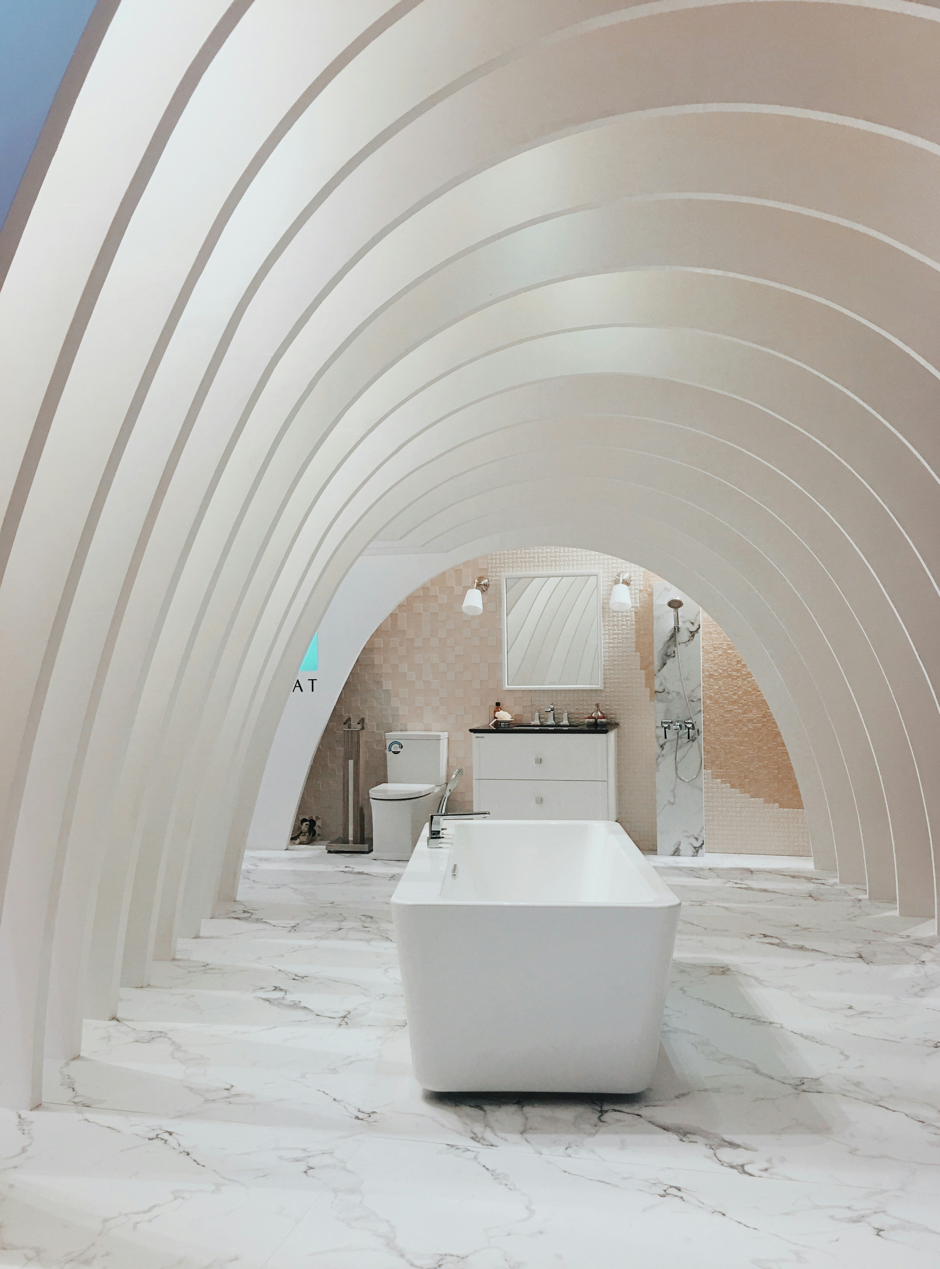 Architectural Echoes: A Minimalist White Corridor with Centerpiece Bathtub