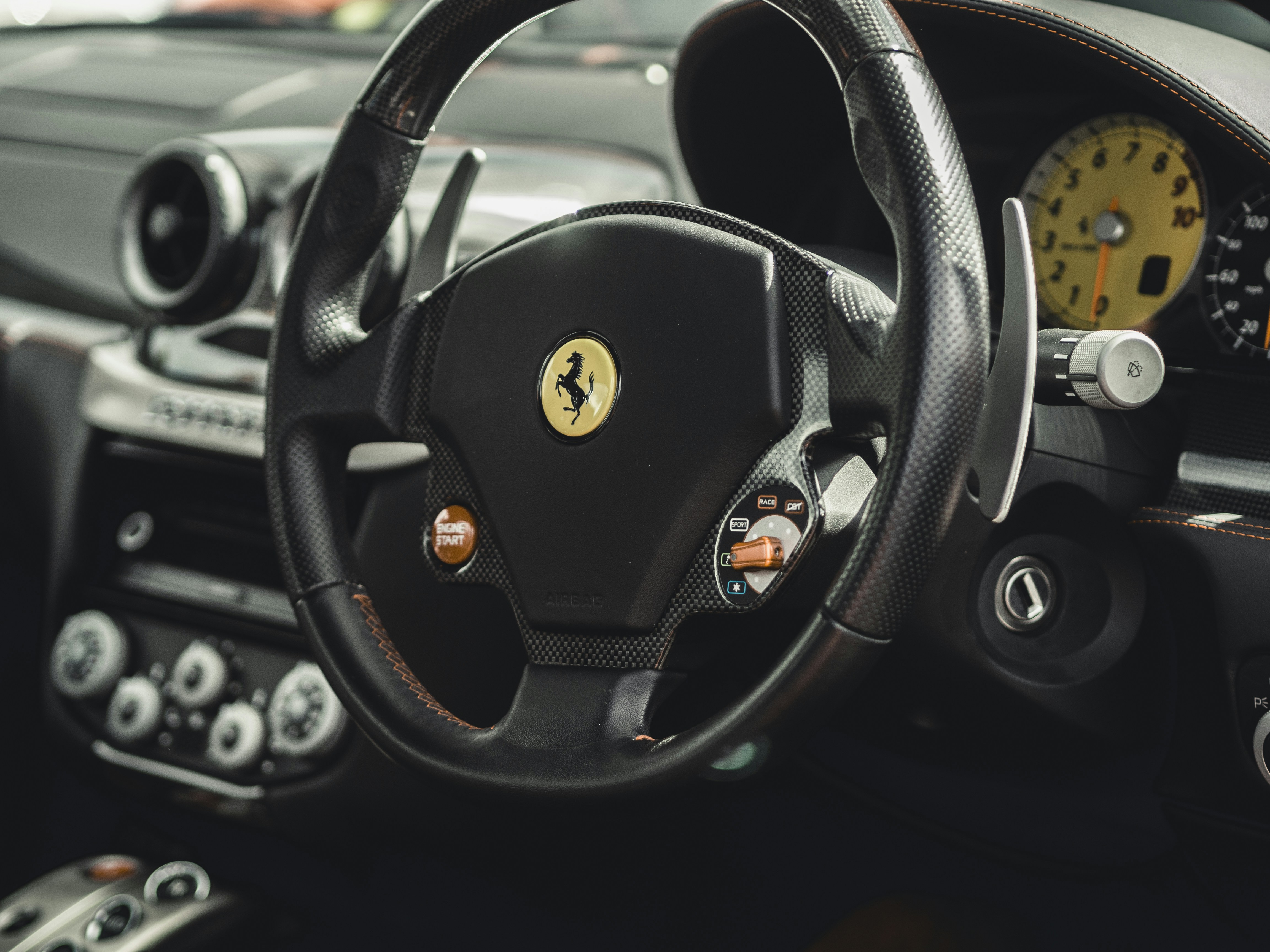 Shallow focus photo of black Ferrari steering wheel photo – Free ...
