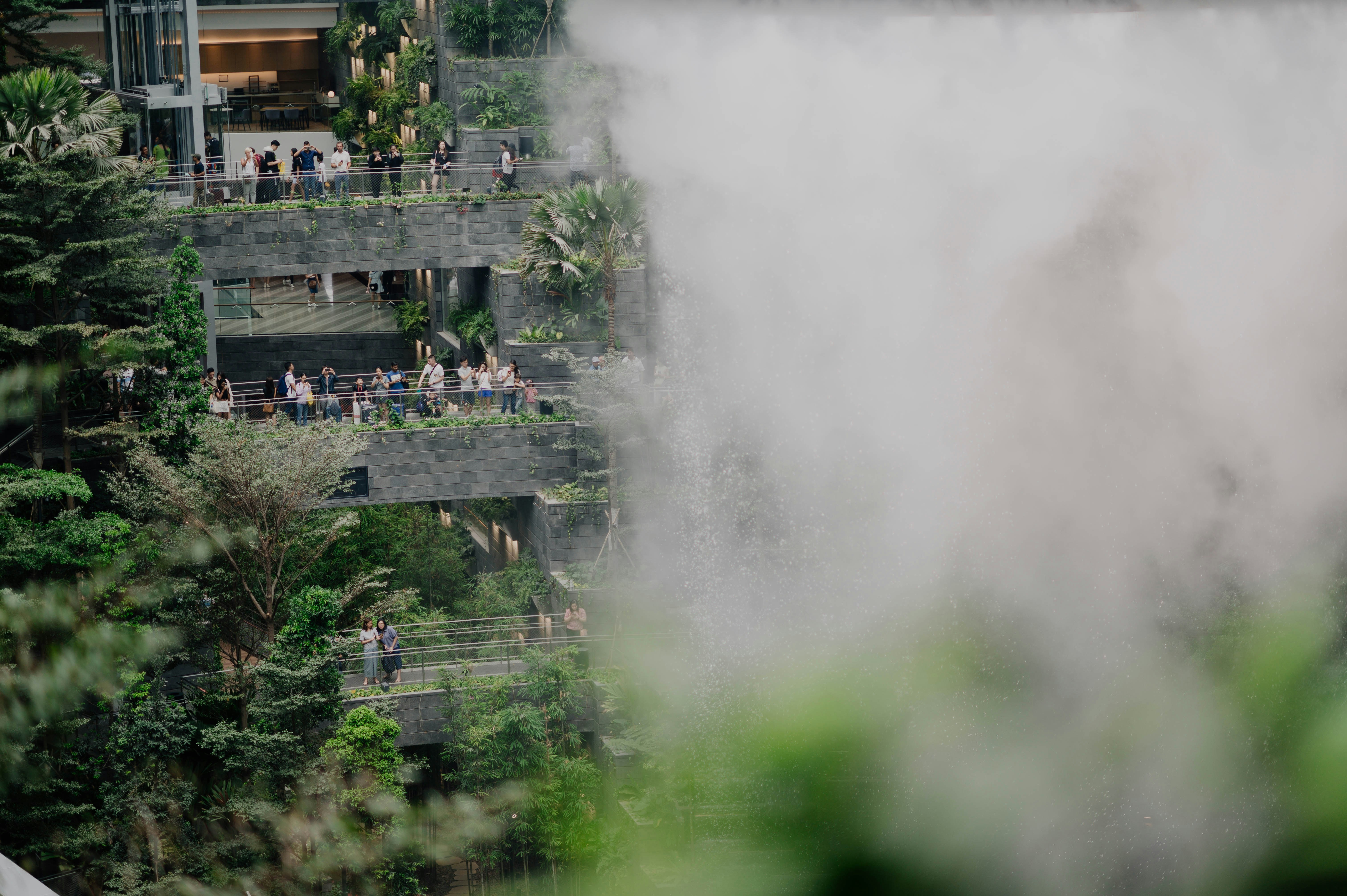 A group of people standing on top of a waterfall photo – Free Nature ...