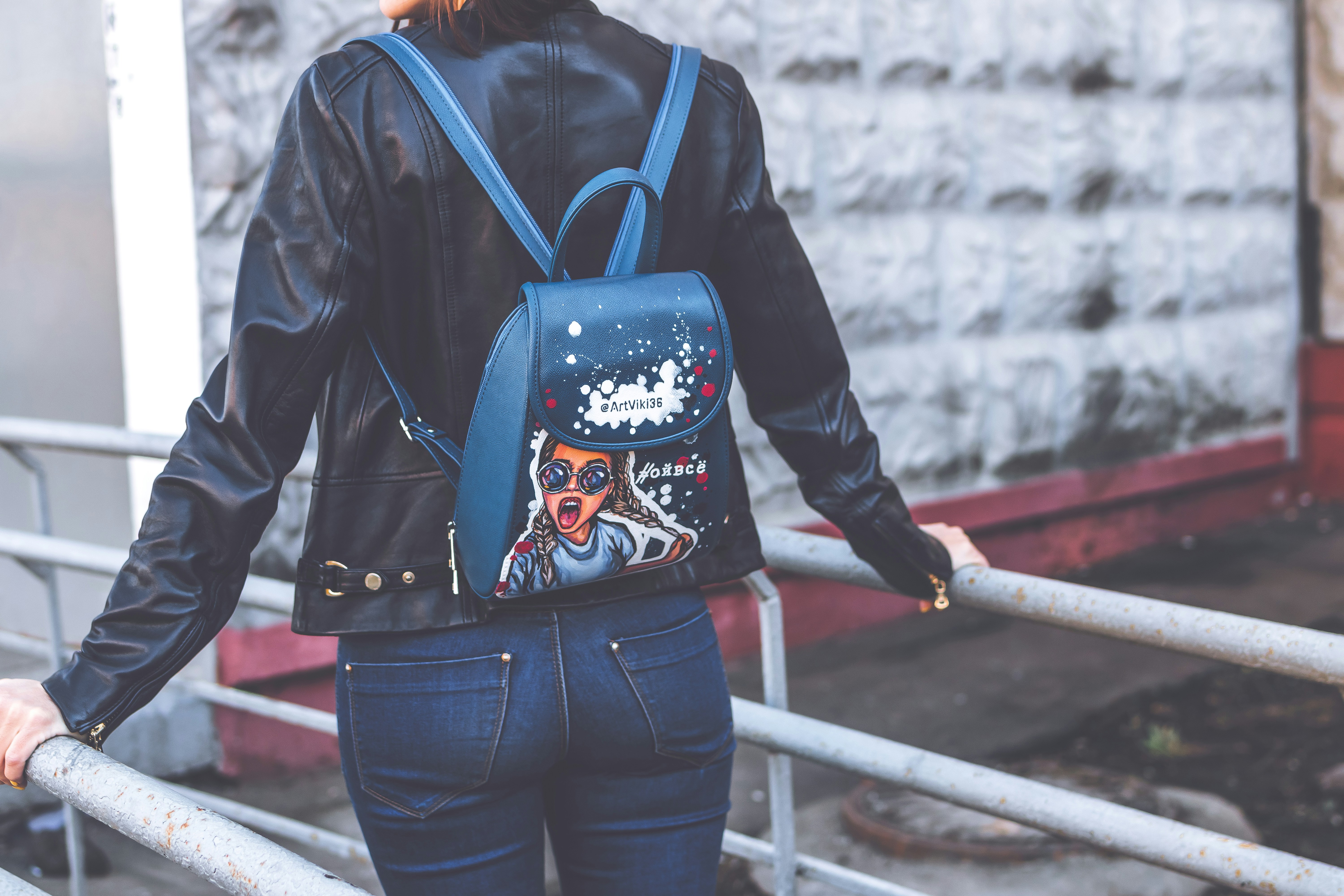 Back View of a Stylish Backpack with Hand-Painted Portrait