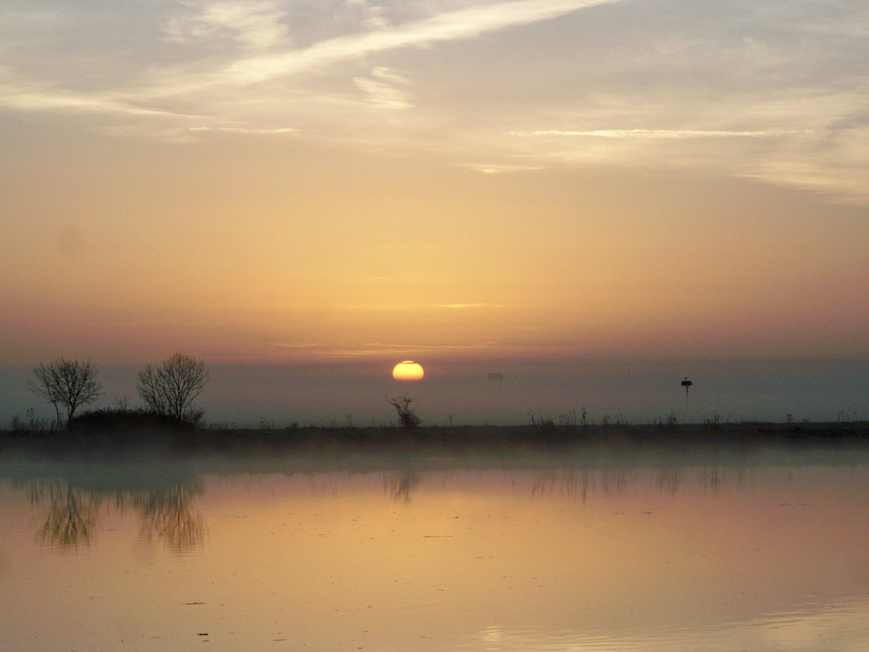 calm water during sunrise