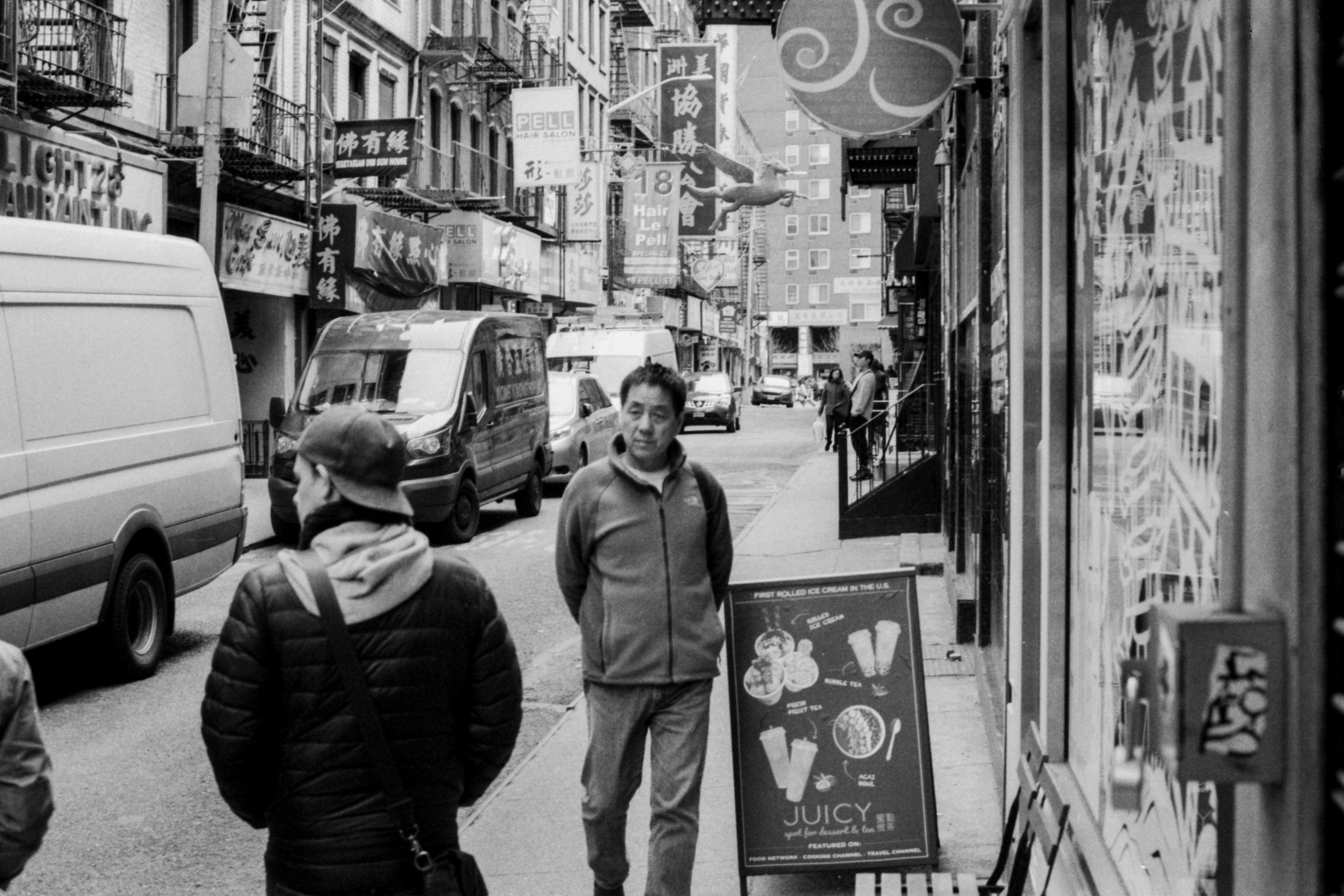 Grayscale photography of vehicles on road photo – Free Human Image on ...