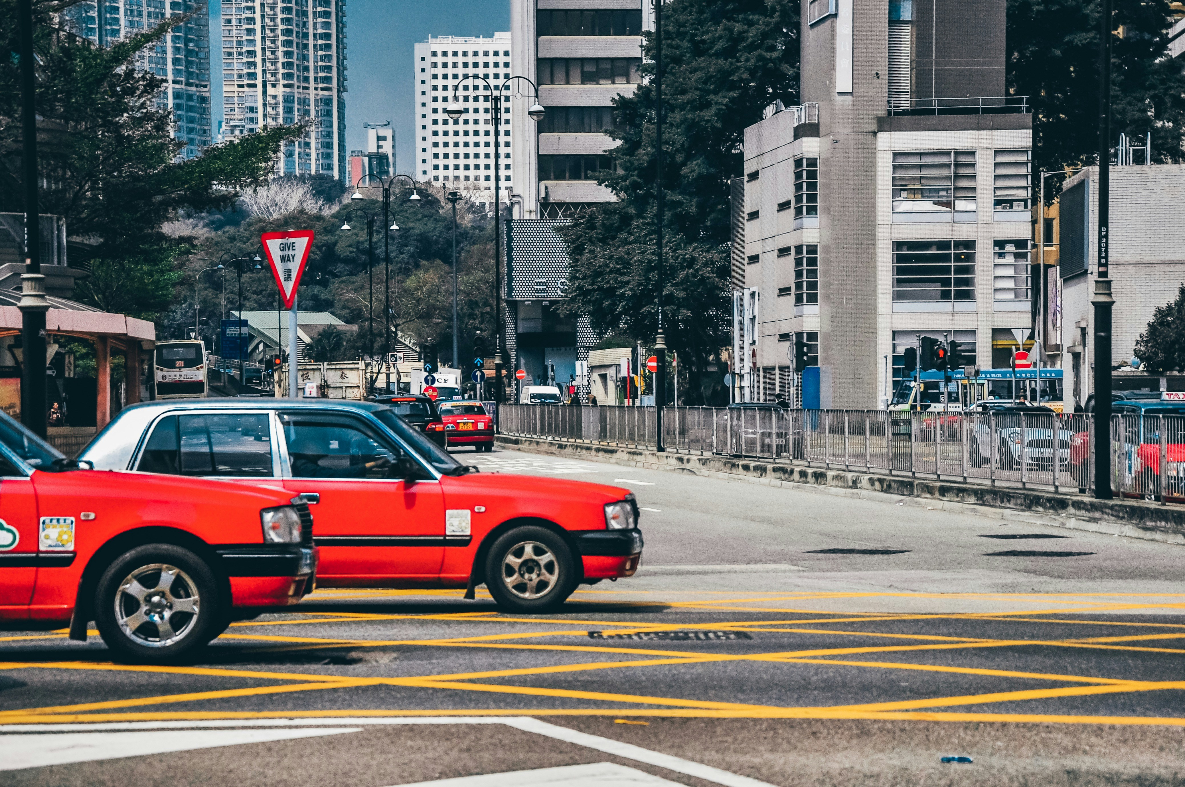 Red car in city photo – Free Automobile Image on Unsplash