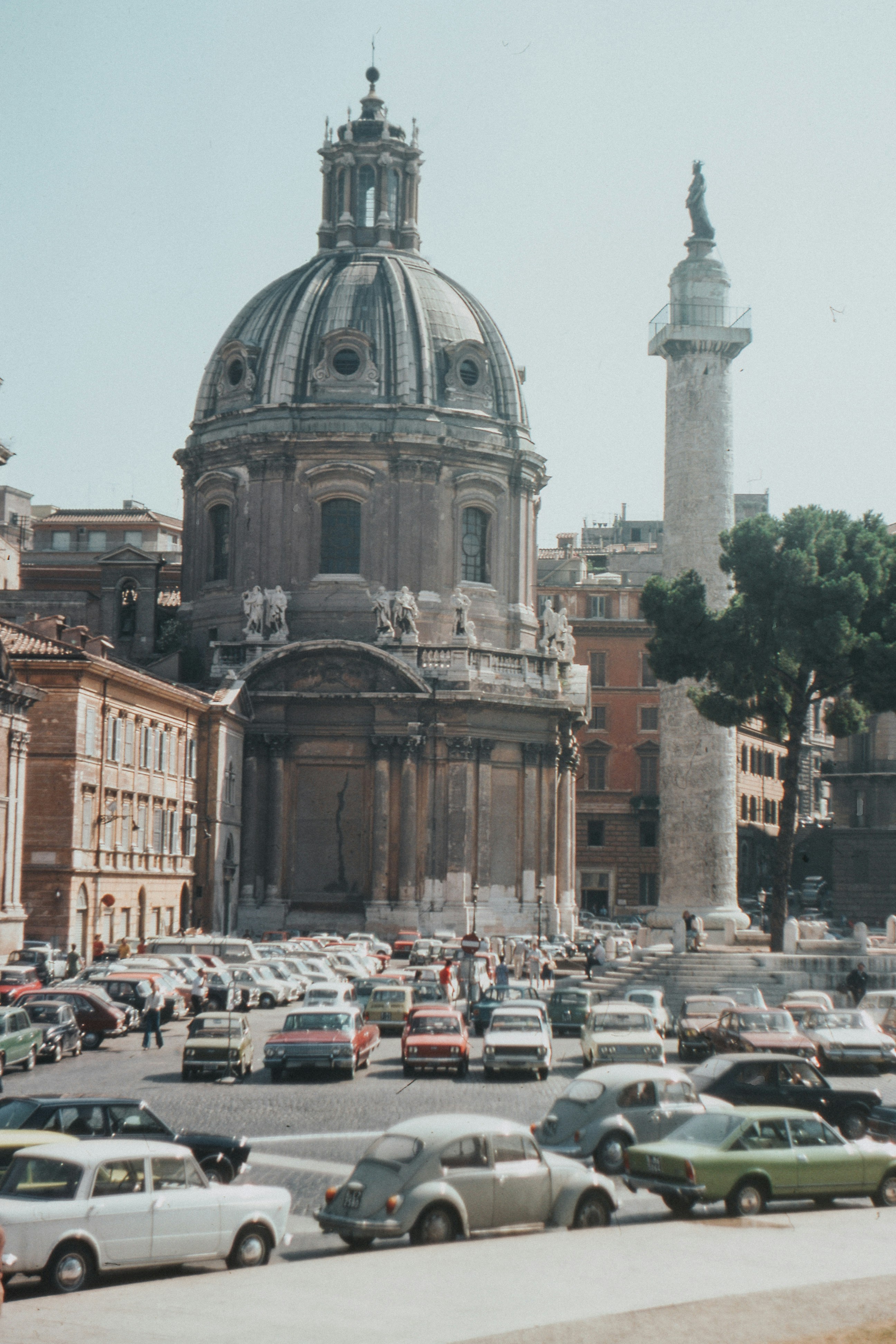 Dome and Obelisk Standoff Over a Busy Piazza