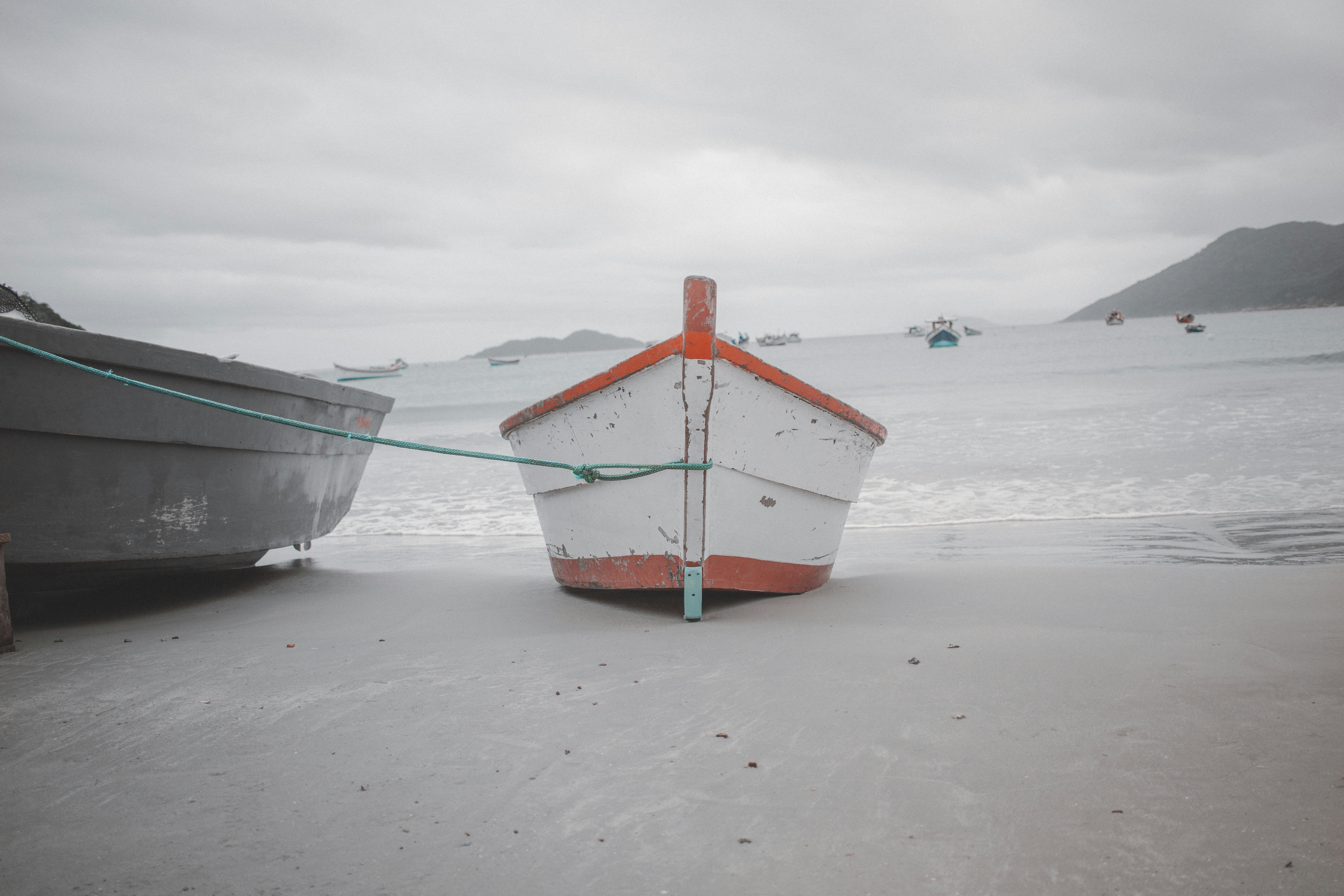 Red-Trimmed Boat at the Quiet Shore
