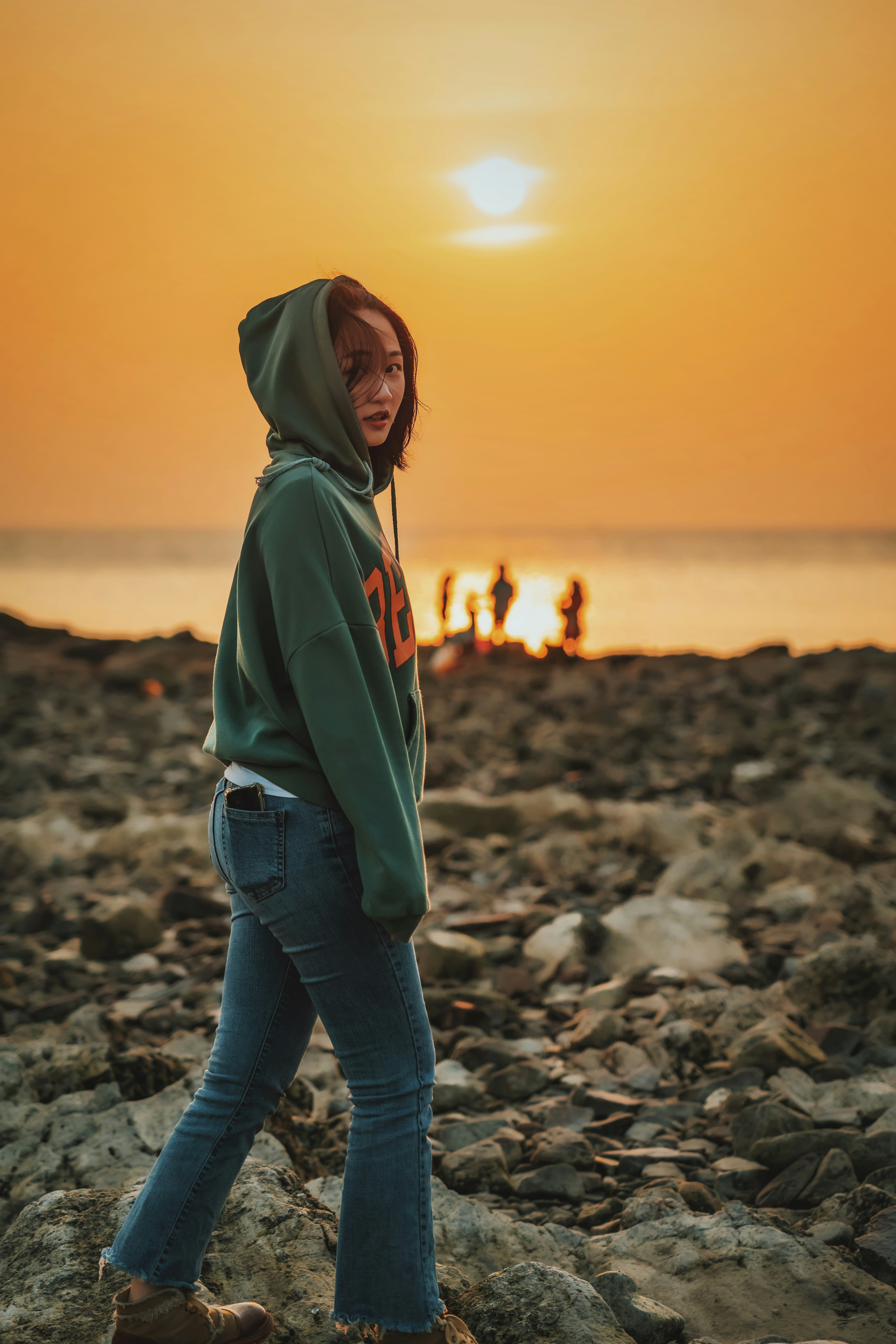Horizonbound Quiet: A Hoodie Portrait at Sunset