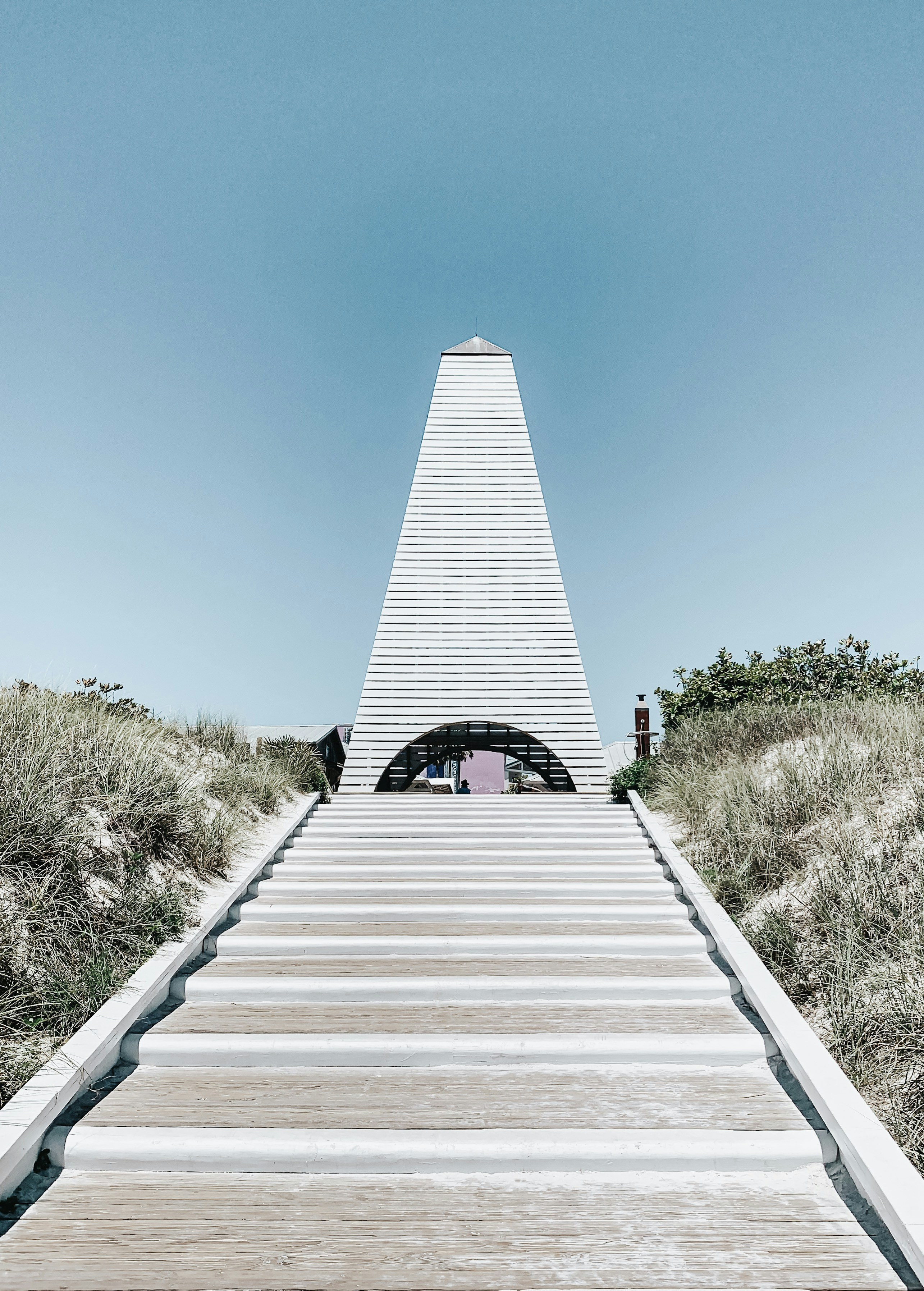 Toward the Sky: A Tapered Seaside Monument Rising Over Coastal Steps