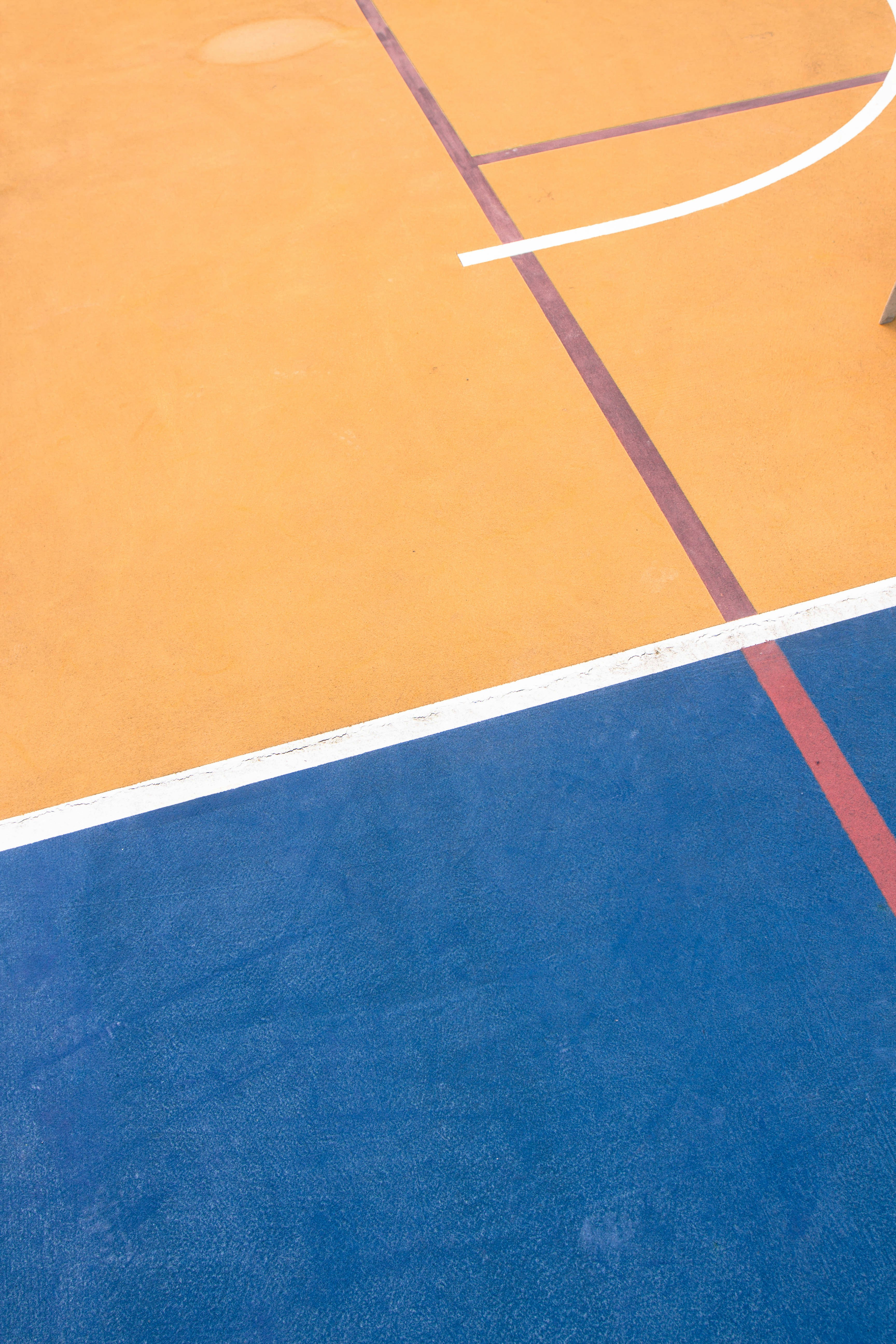 A man standing on top of a basketball court holding a racquet photo ...