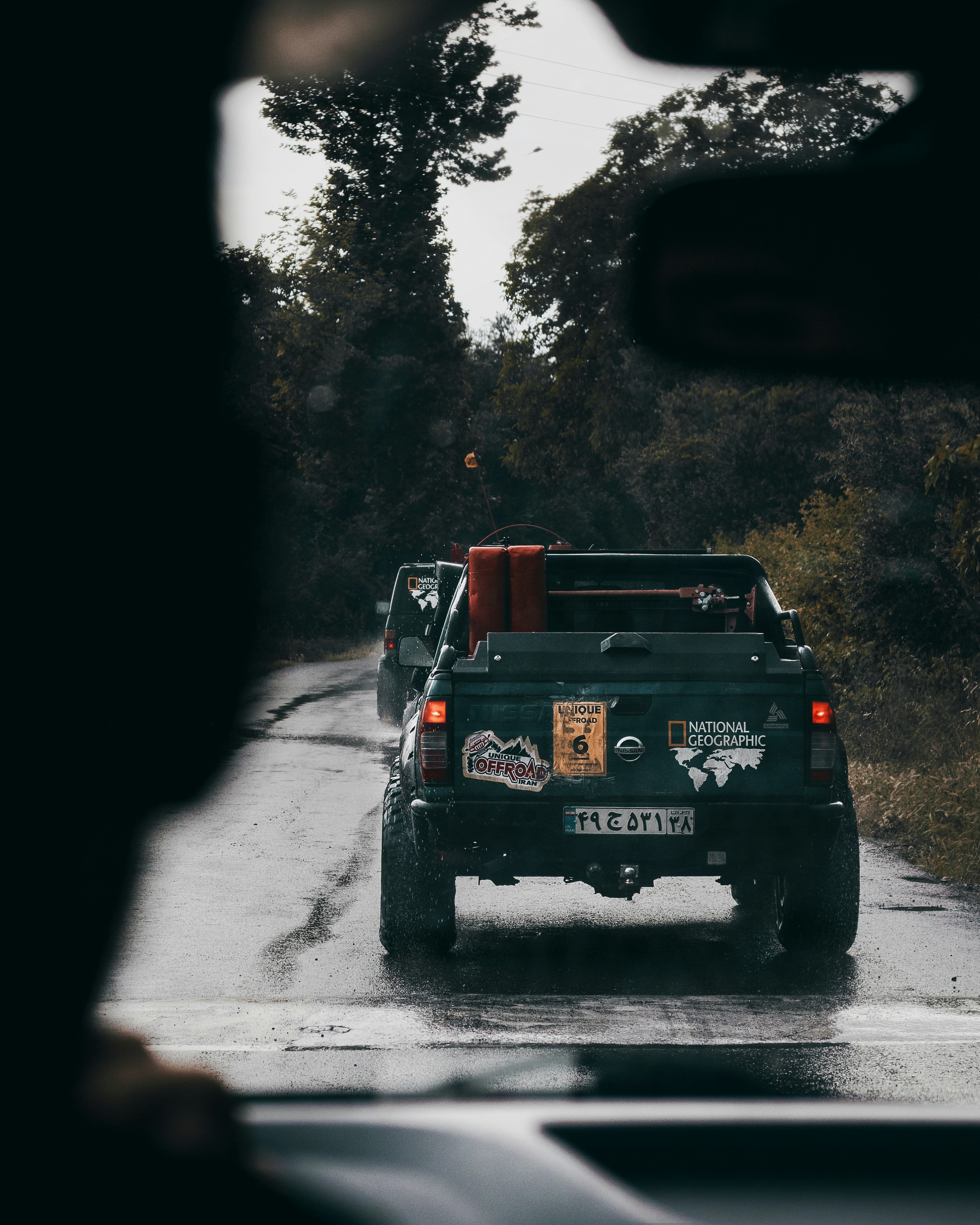 Green vehicle on road near plants photo – Free Iran Image on Unsplash