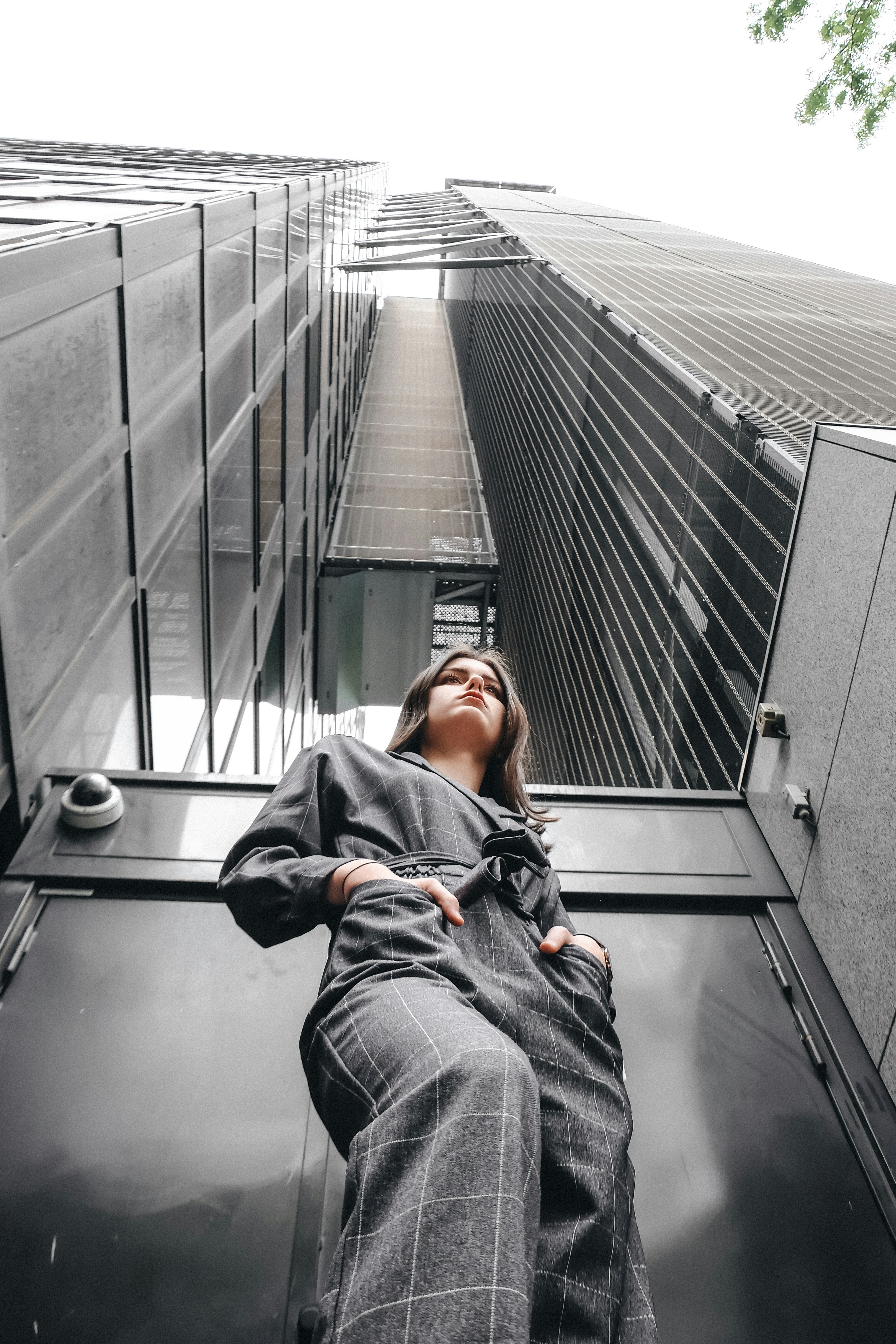 Woman standing in front of high-rise building photo – Free Style Image ...