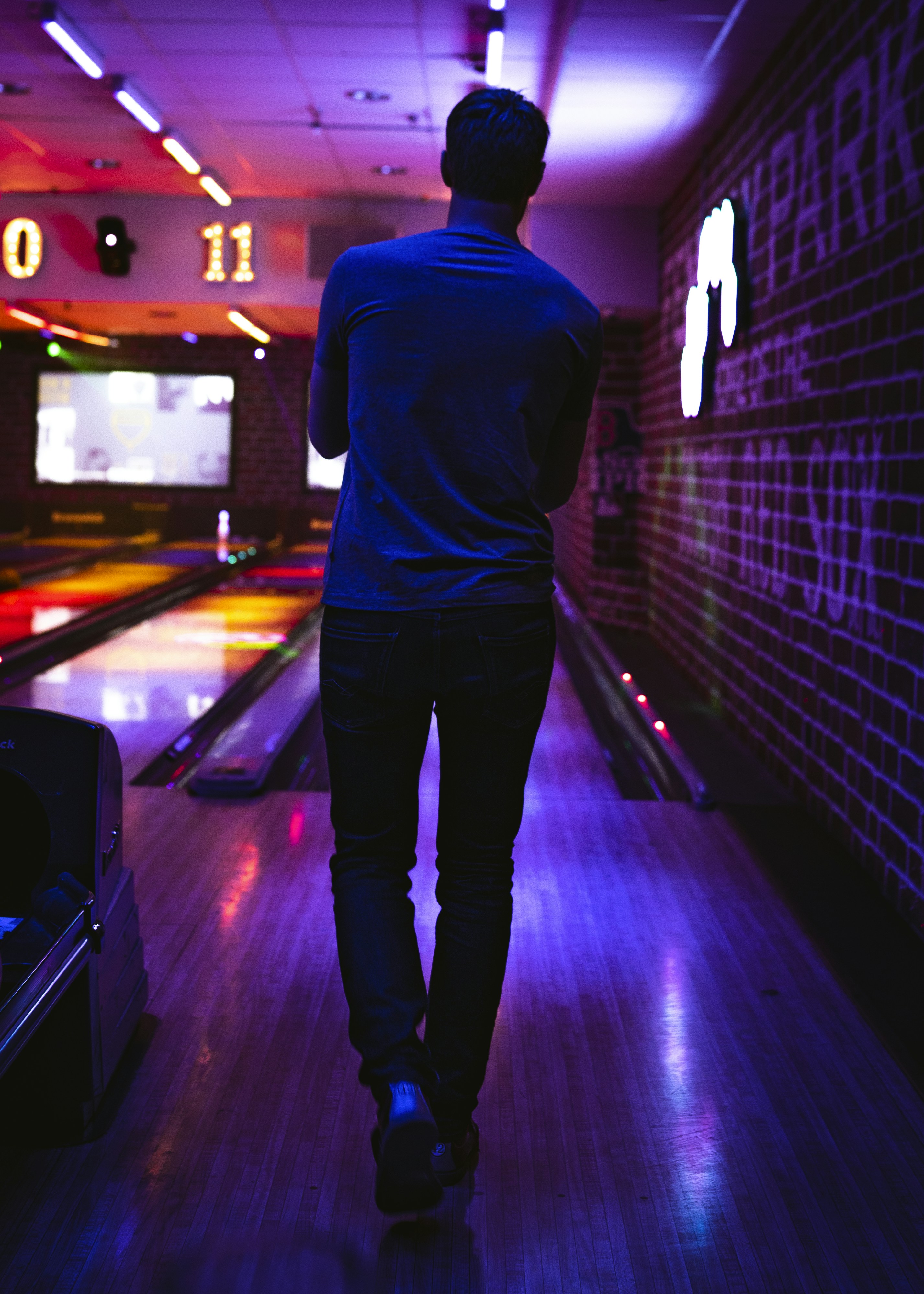 Neon Lane Reverie: The Bowler in Violet Light